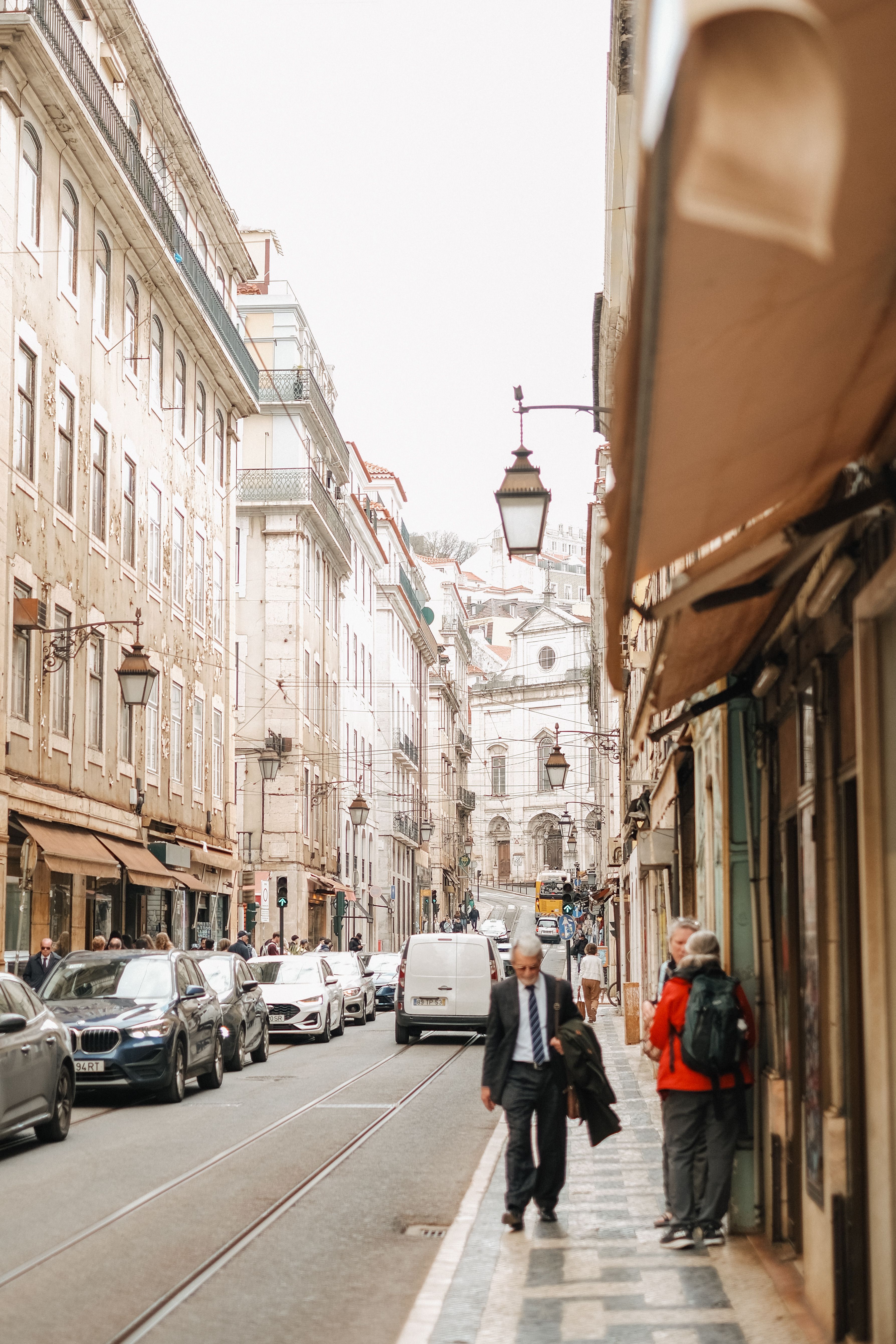 Charming European Street Scene with Pedestrians · Free Stock Photo
