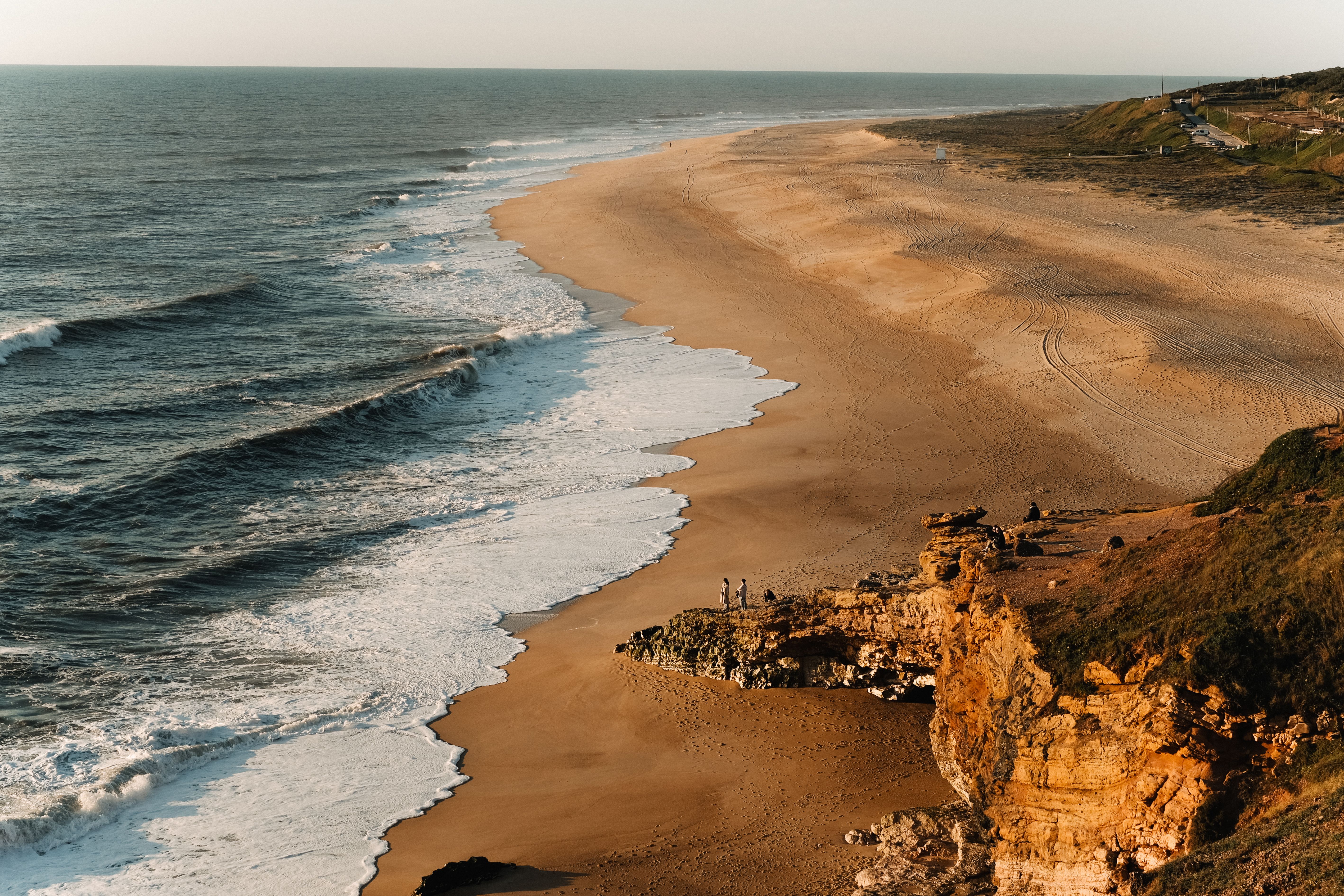 Scenic Beach View with Cliff and Ocean Waves · Free Stock Photo