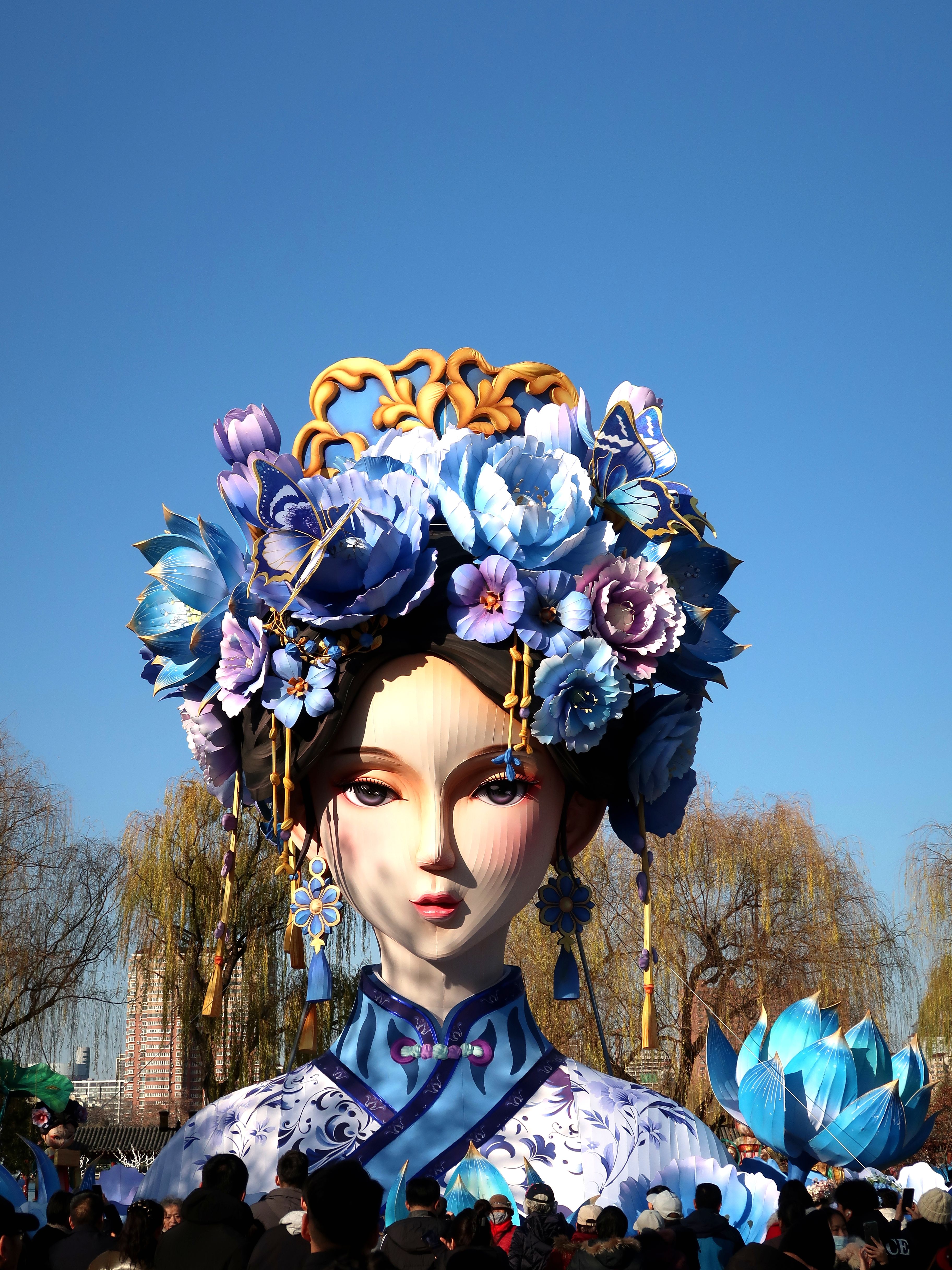Vibrant Festival Parade with Giant Floral Sculpture · Free Stock Photo
