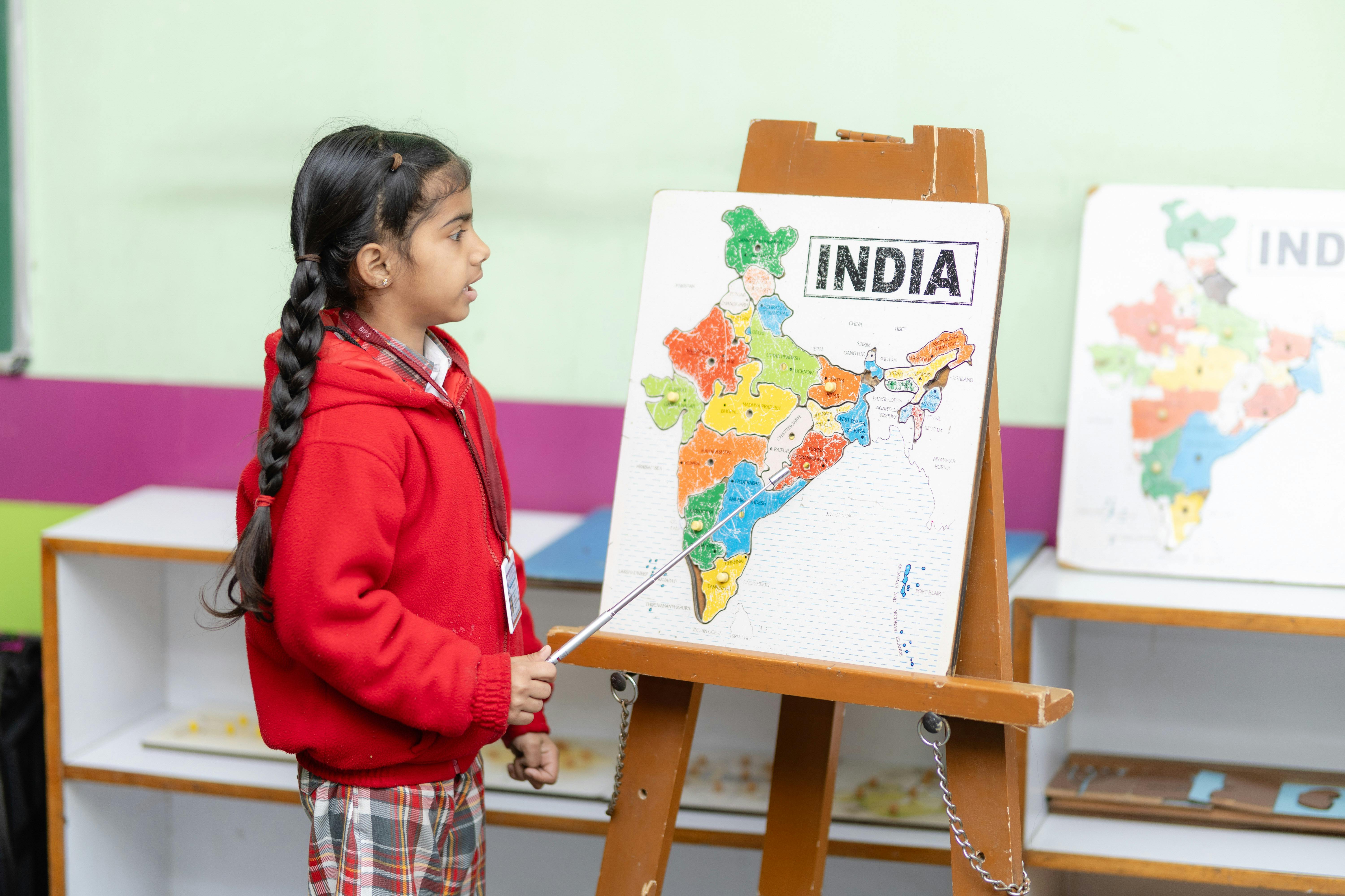 Young Girl Learning Geography with Indian Map · Free Stock Photo