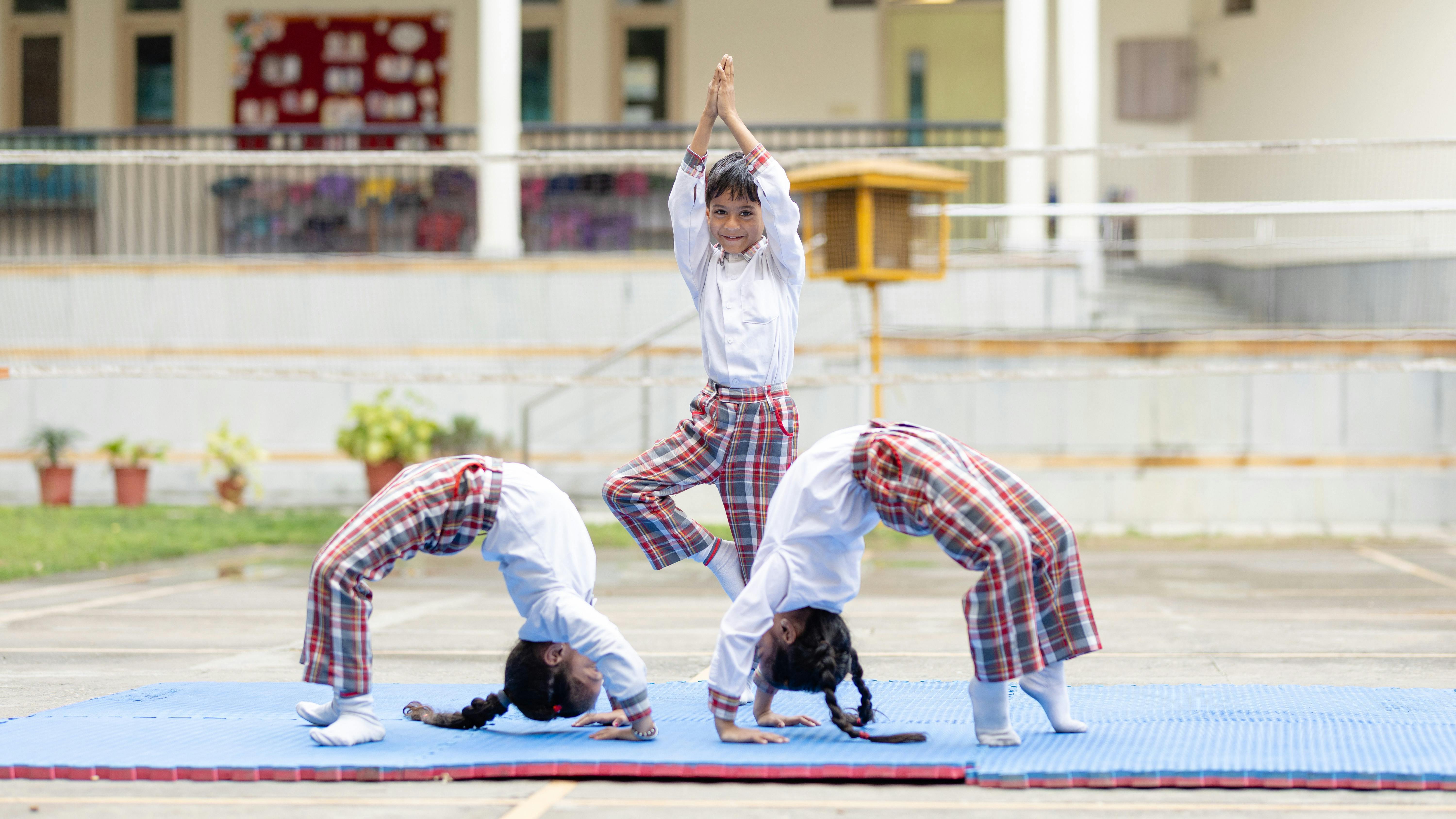 Active Children Doing Balancing Exercises · Free Stock Photo