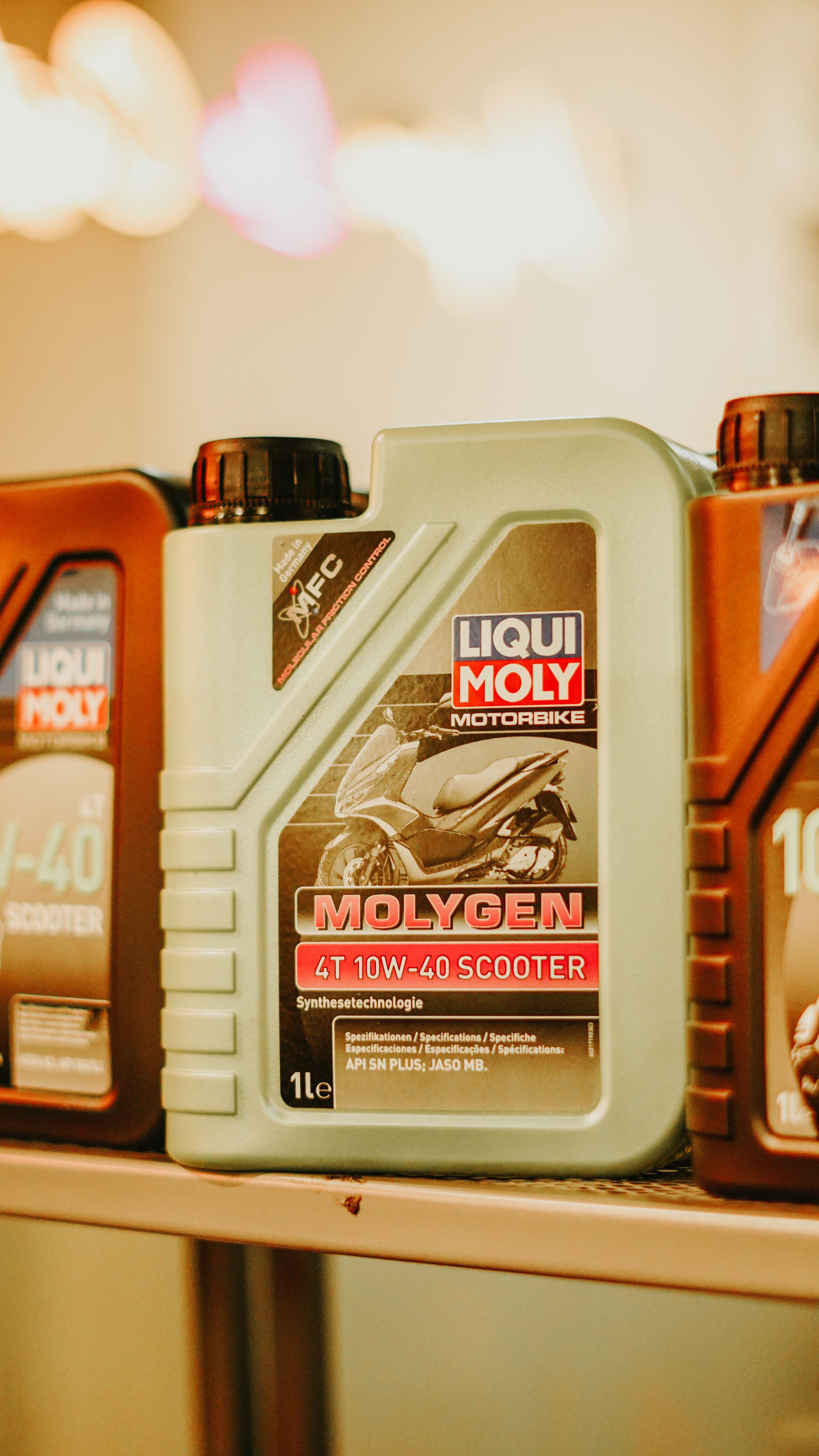 Liqui Moly Motorbike Oil Containers in Store Display · Free Stock Photo