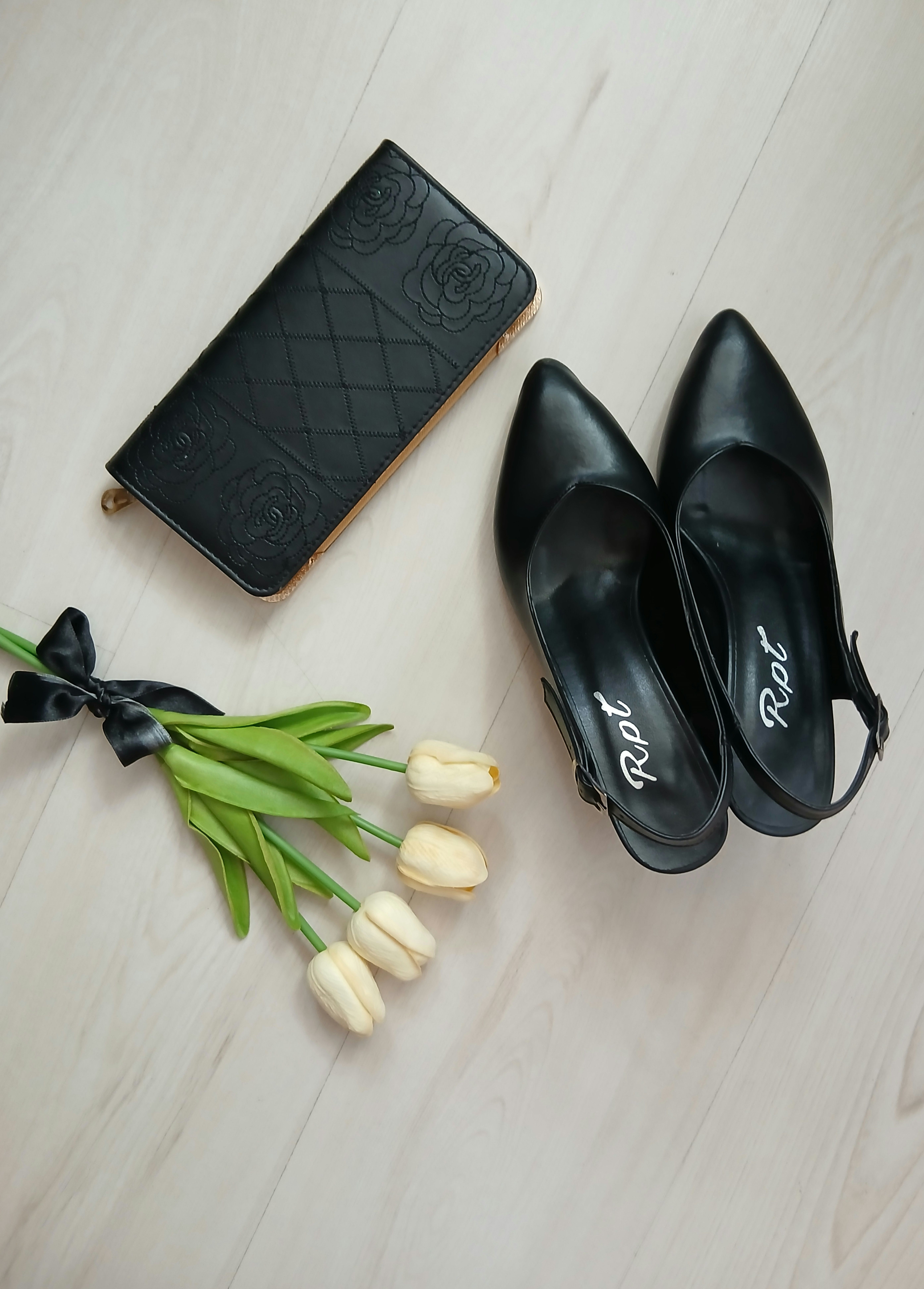 Elegant Flat Lay of Black Heels and Accessories · Free Stock Photo