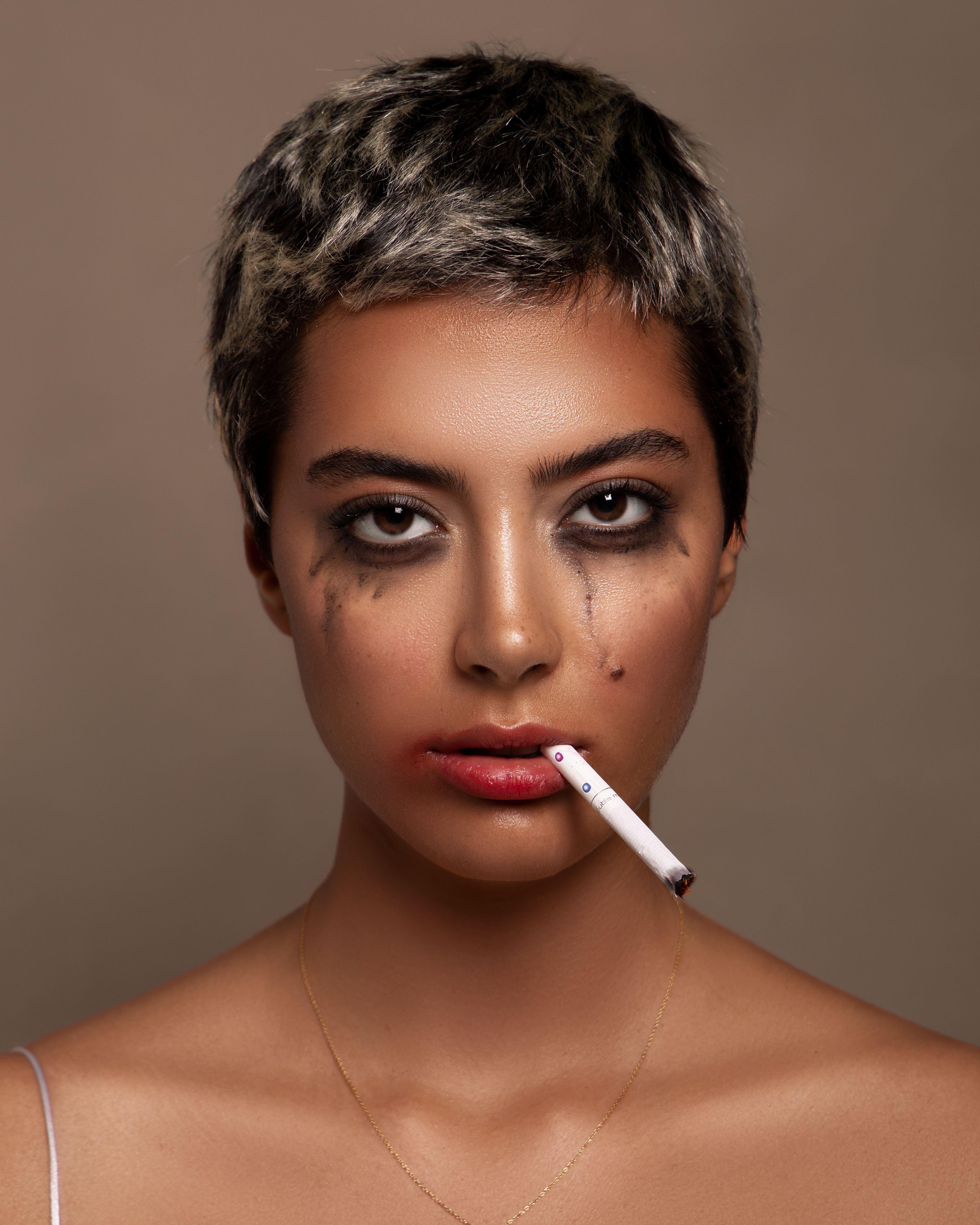 Edgy Portrait with Cigarette and Smudged Makeup · Free Stock Photo