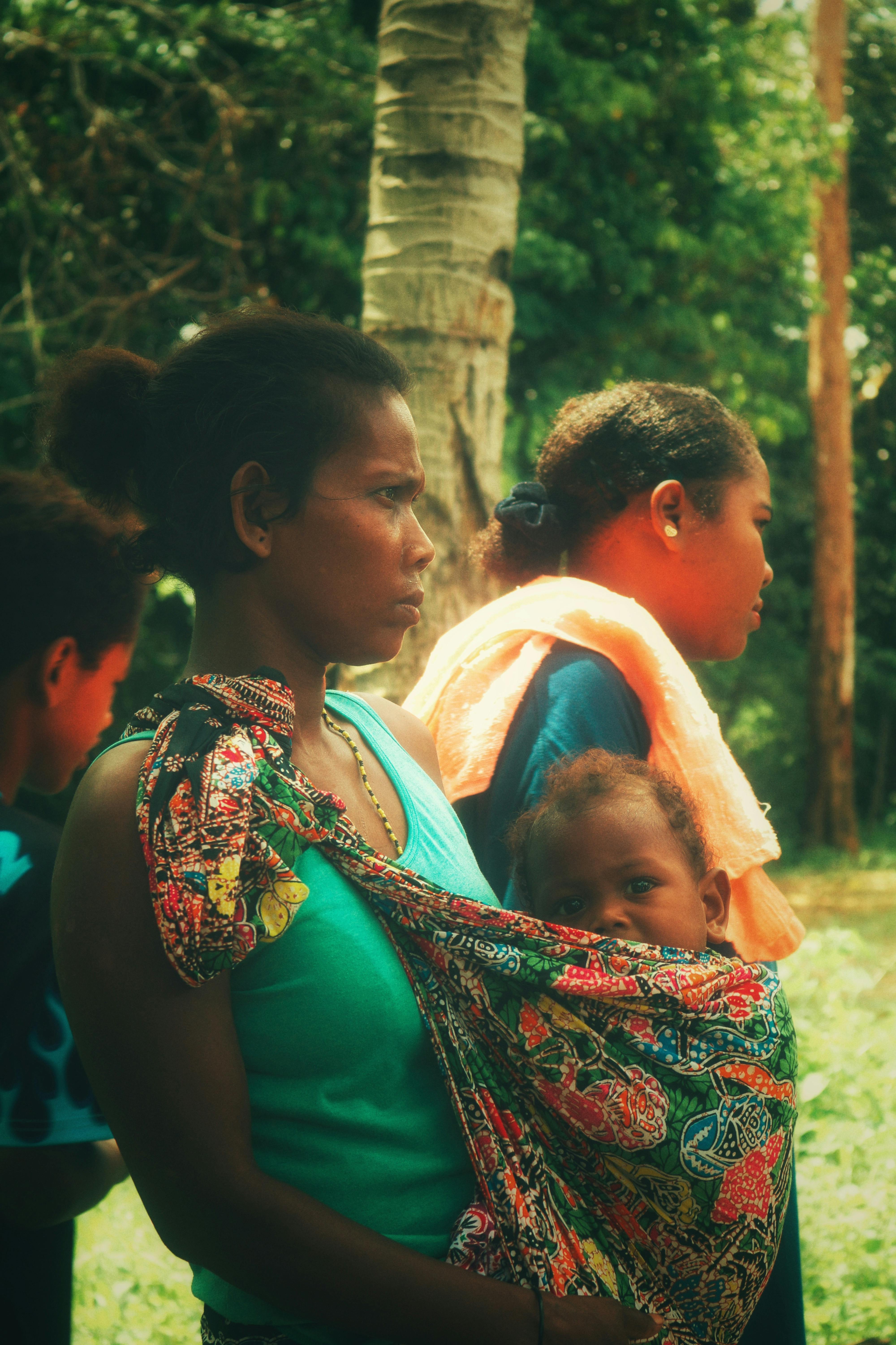 Cultural Portrait of a Batek Family Outdoors · Free Stock Photo