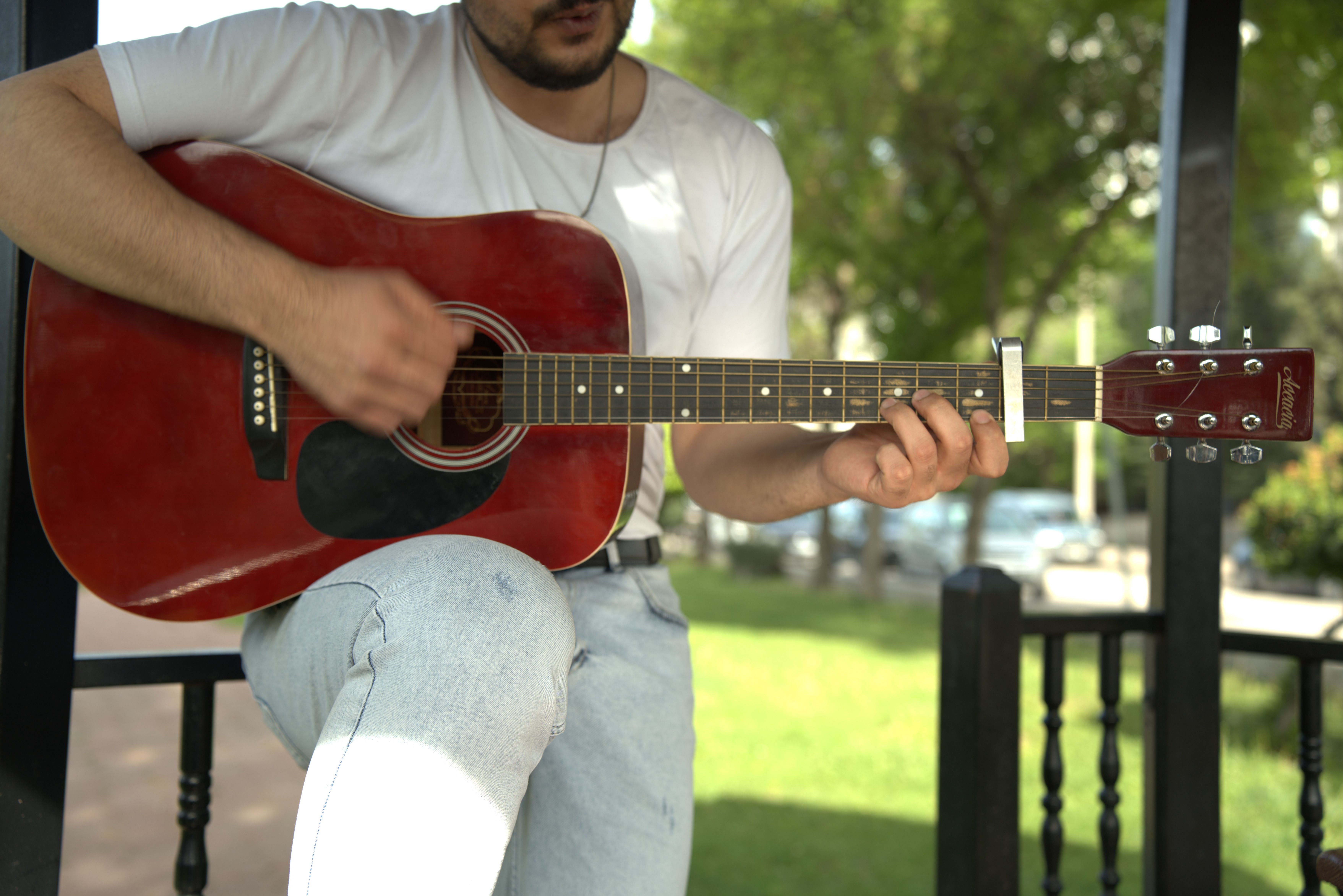 Casual Acoustic Guitarist Playing Outdoors · Free Stock Photo