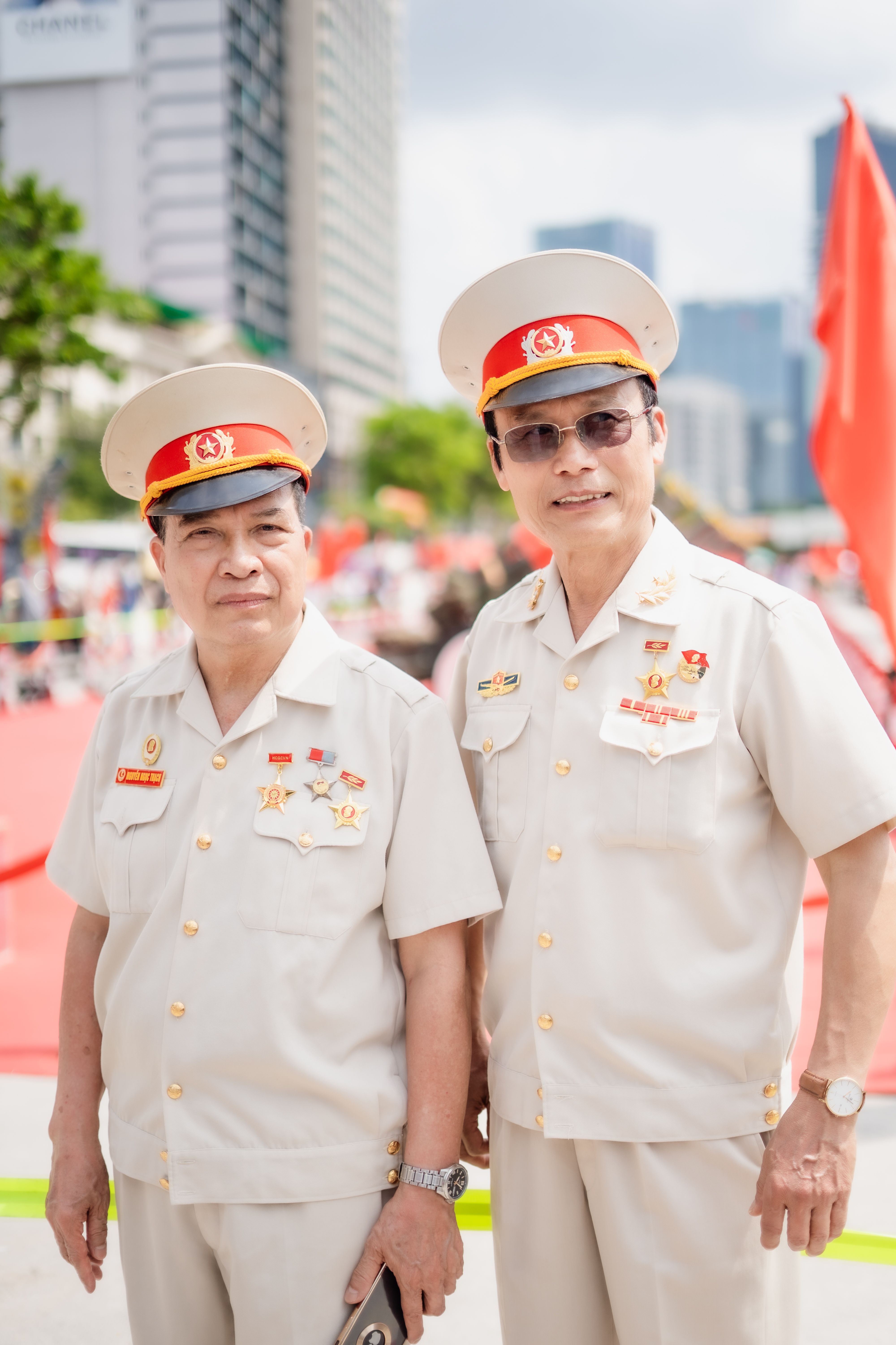 Two Uniformed Officers Smiling Outdoors · Free Stock Photo