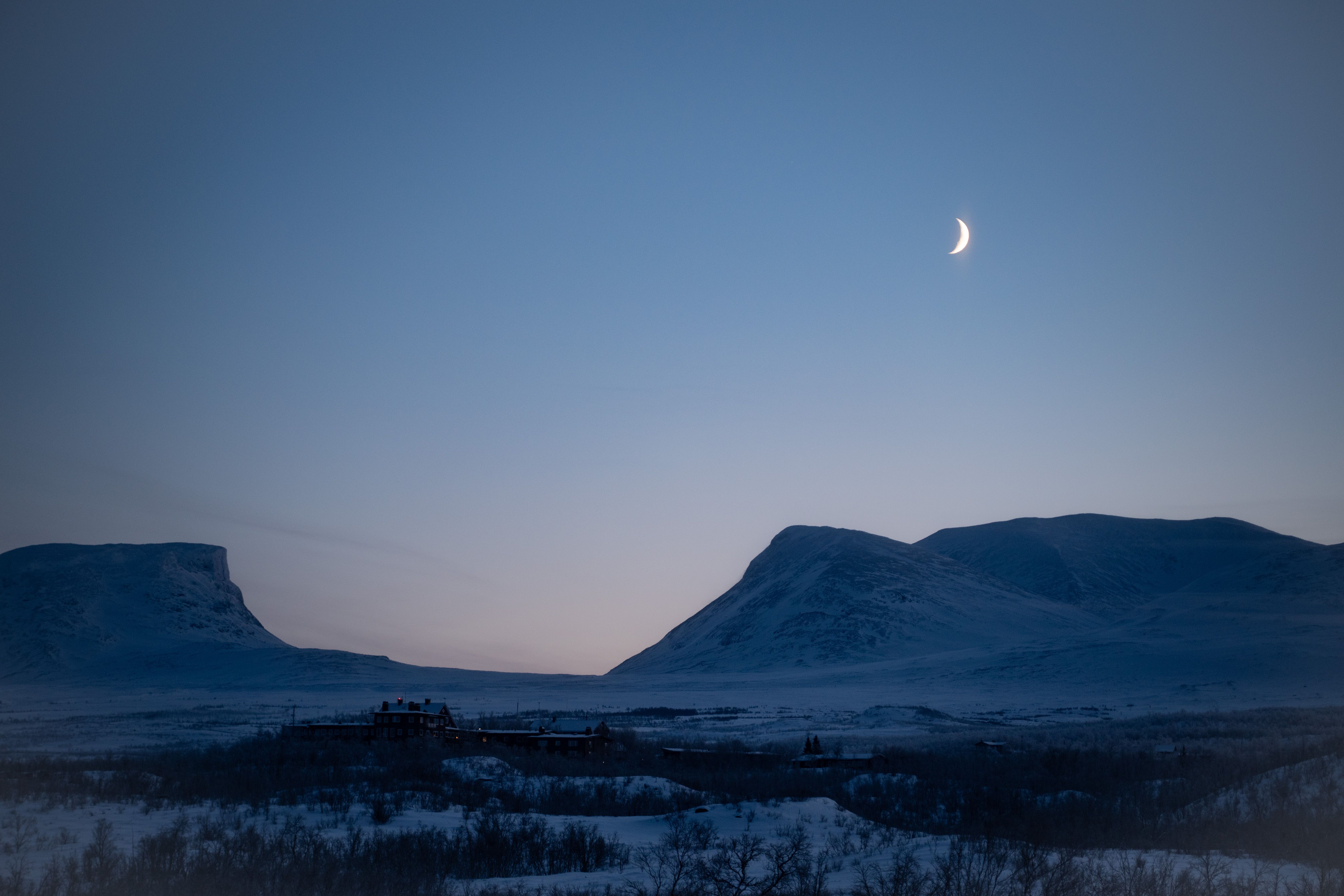 Crescent Moon Over Snowy Abisko Mountains · Free Stock Photo