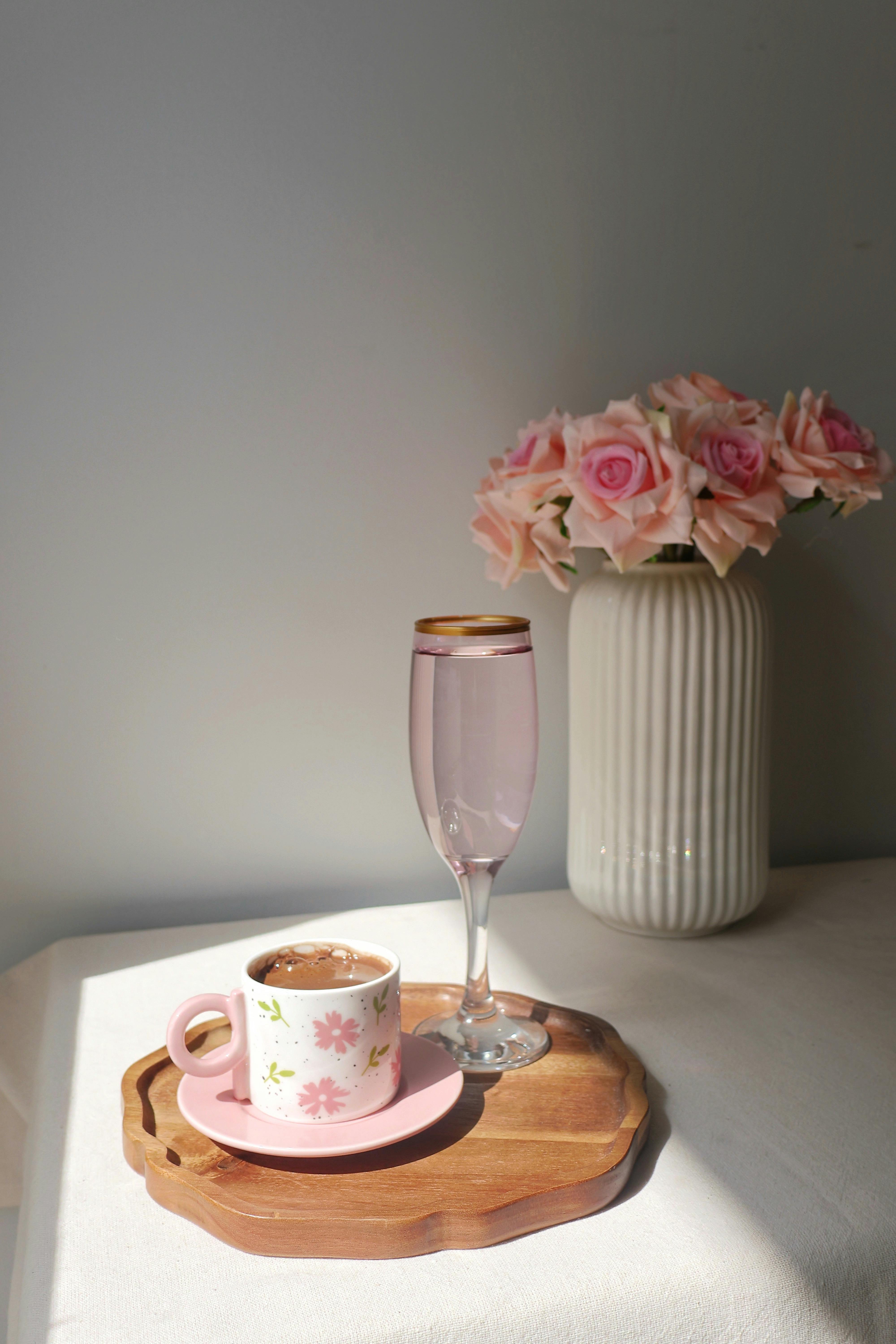 Cozy Morning Coffee Setup with Pink Flowers · Free Stock Photo