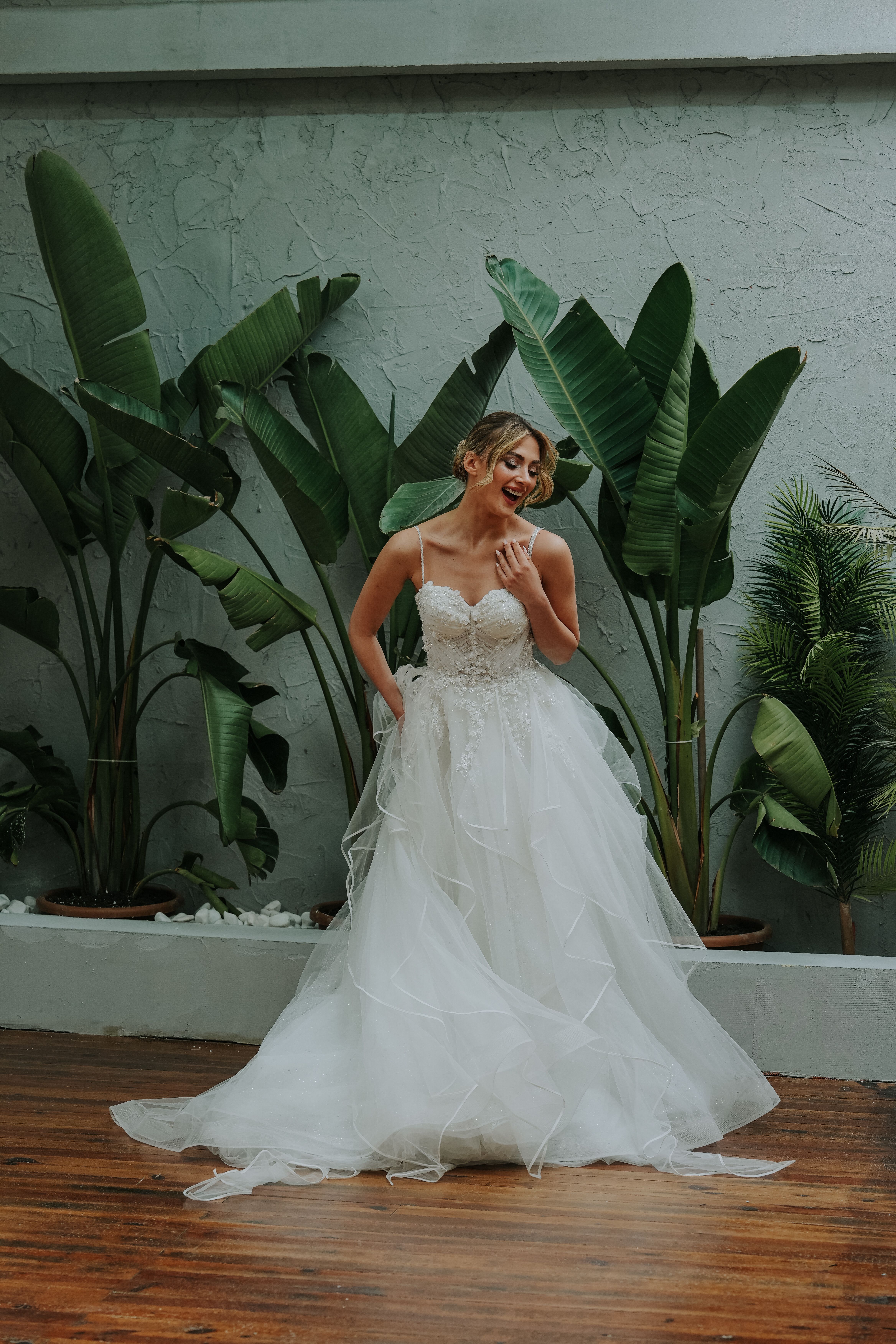 Elegant Bride Posing in Tropical Indoor Setting · Free Stock Photo