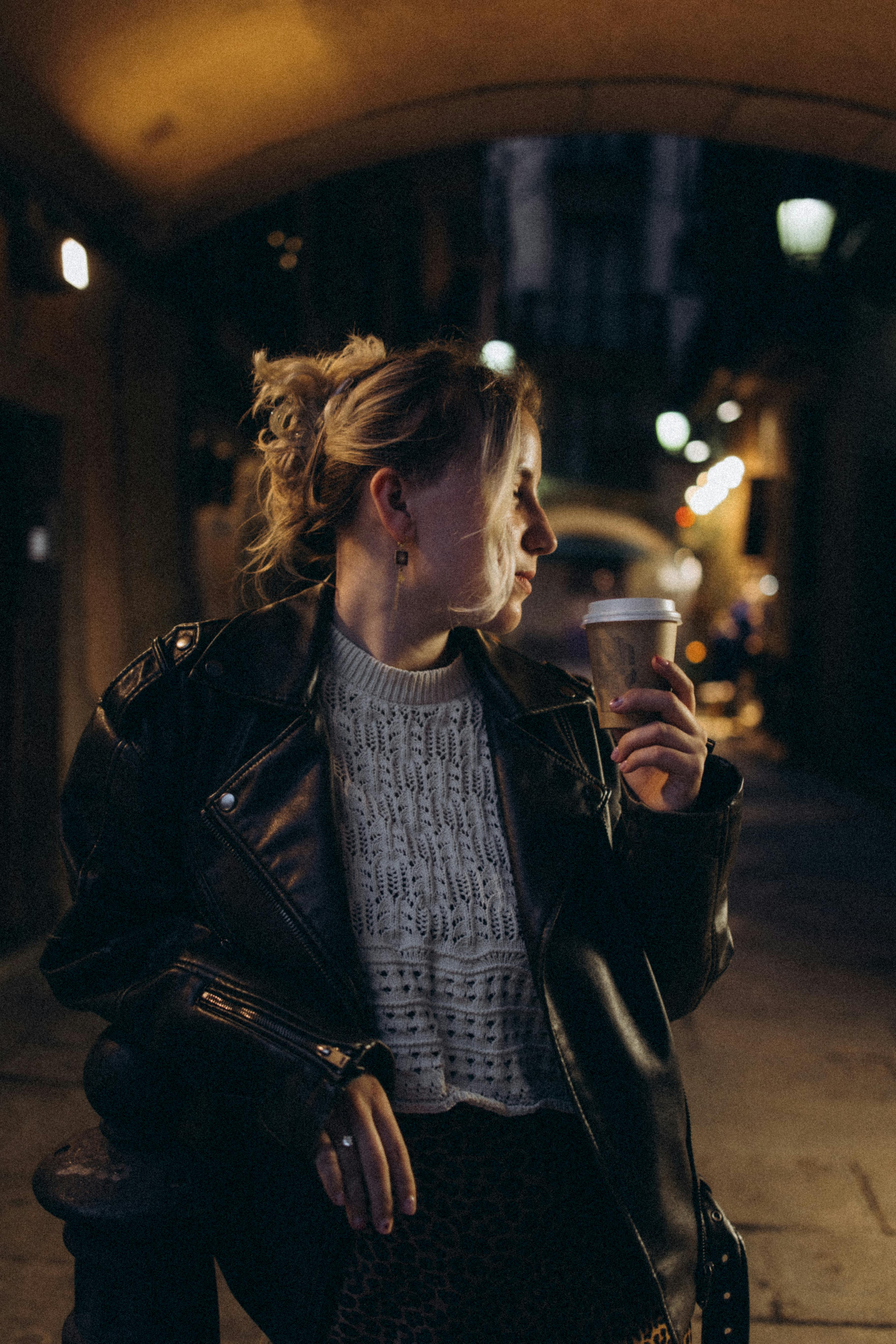 Nightlife Stroll with Coffee in Hand · Free Stock Photo