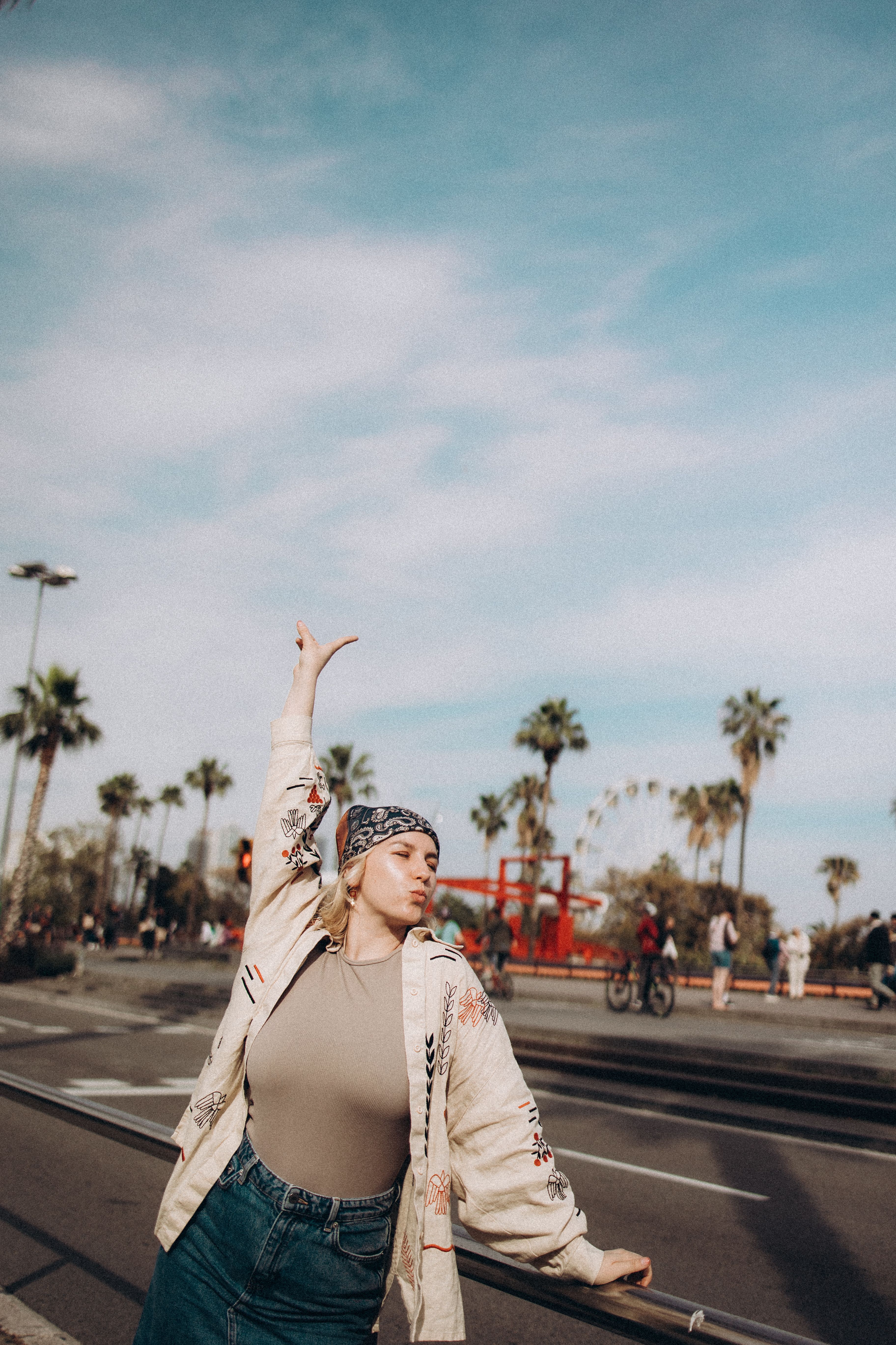 Young Woman Posing Energetically in Urban Park · Free Stock Photo