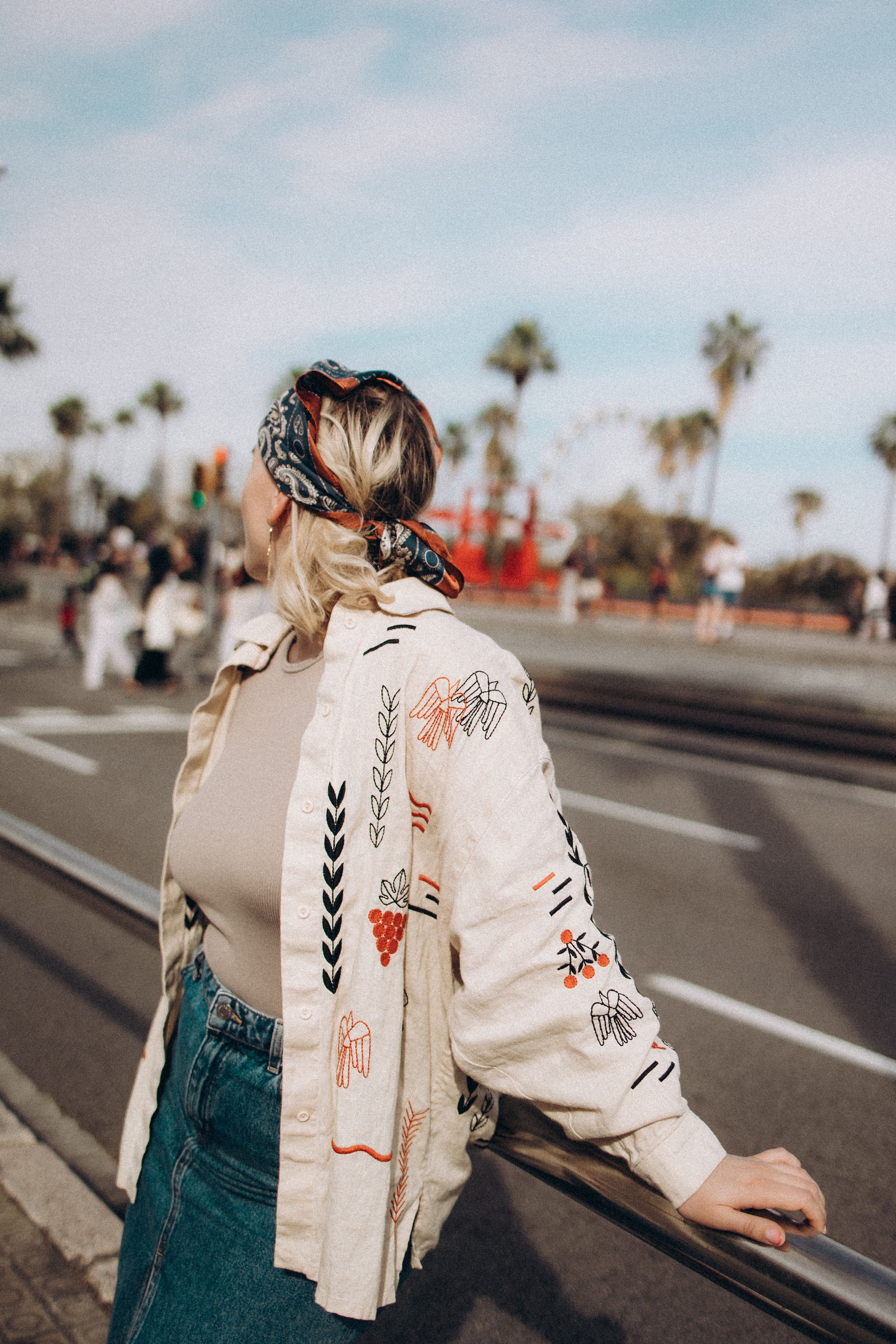 Woman in Stylish Attire Exploring Urban Landscape · Free Stock Photo