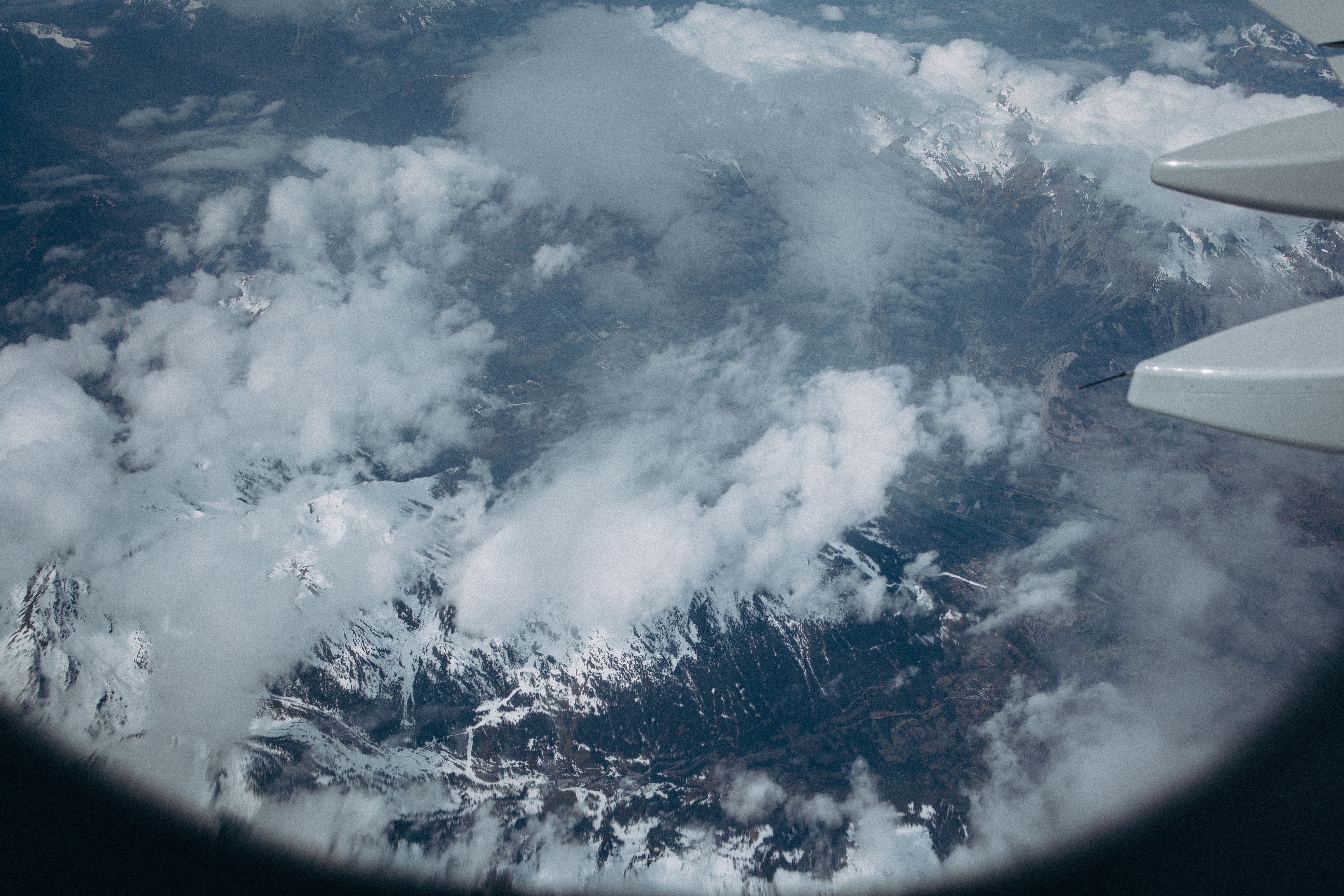 Aerial View of Snow-Capped Mountains from Airplane Window · Free Stock ...