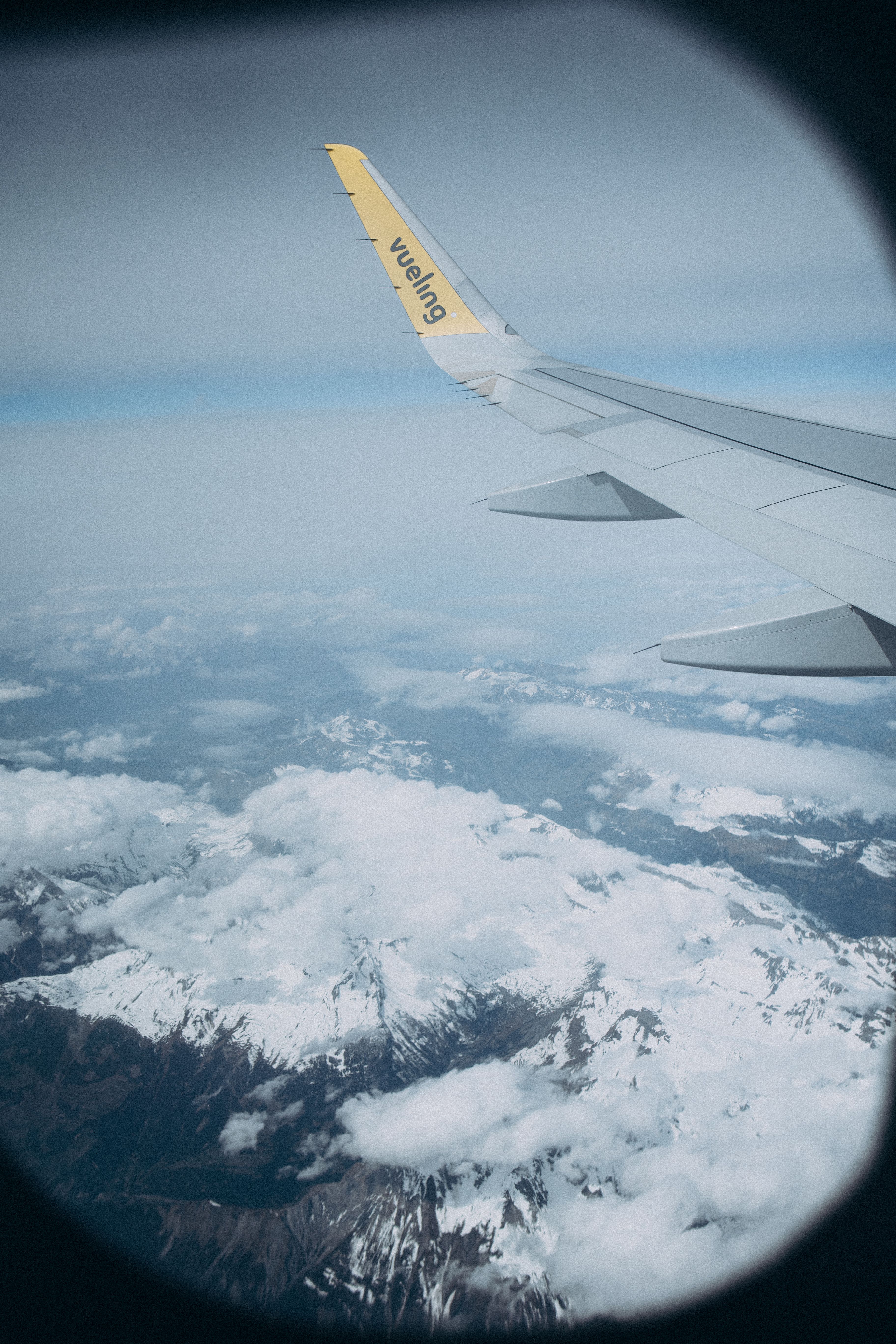 Aerial View of Snowy Mountains from Airplane · Free Stock Photo