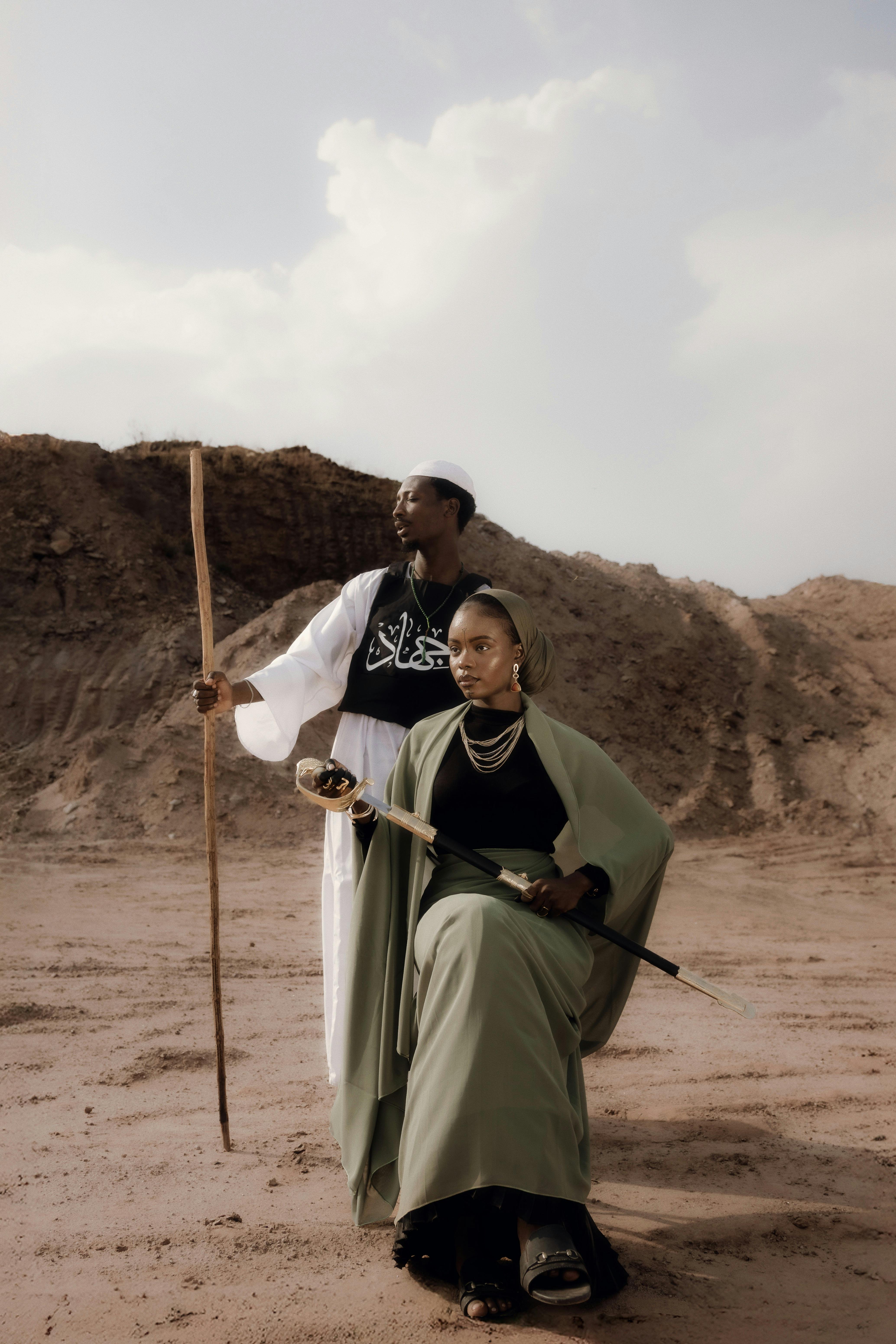 Traditional African Garb in Nigerian Desert Setting · Free Stock Photo