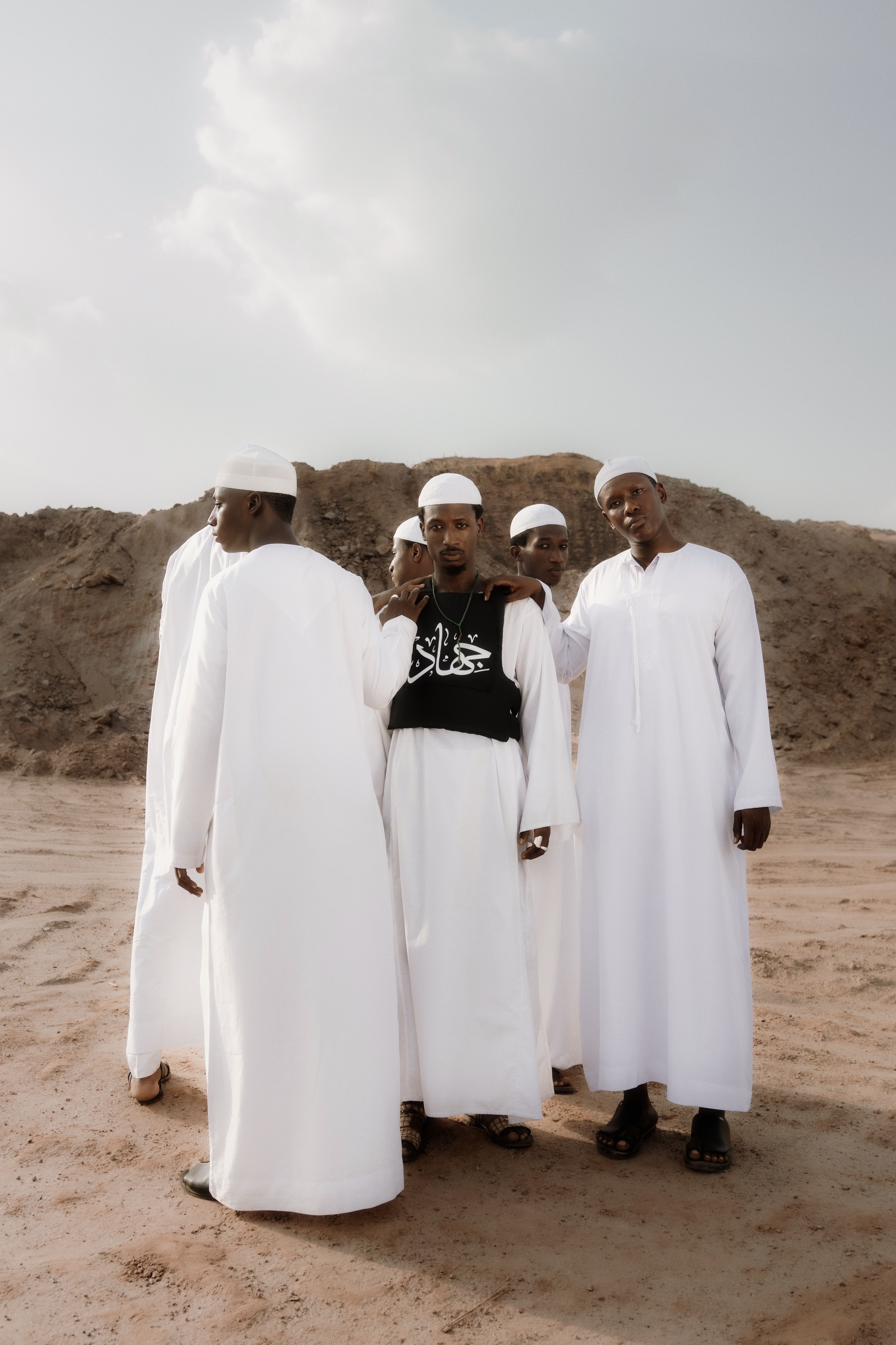 Group of Men in Traditional Attire in Nigerian Desert · Free Stock Photo