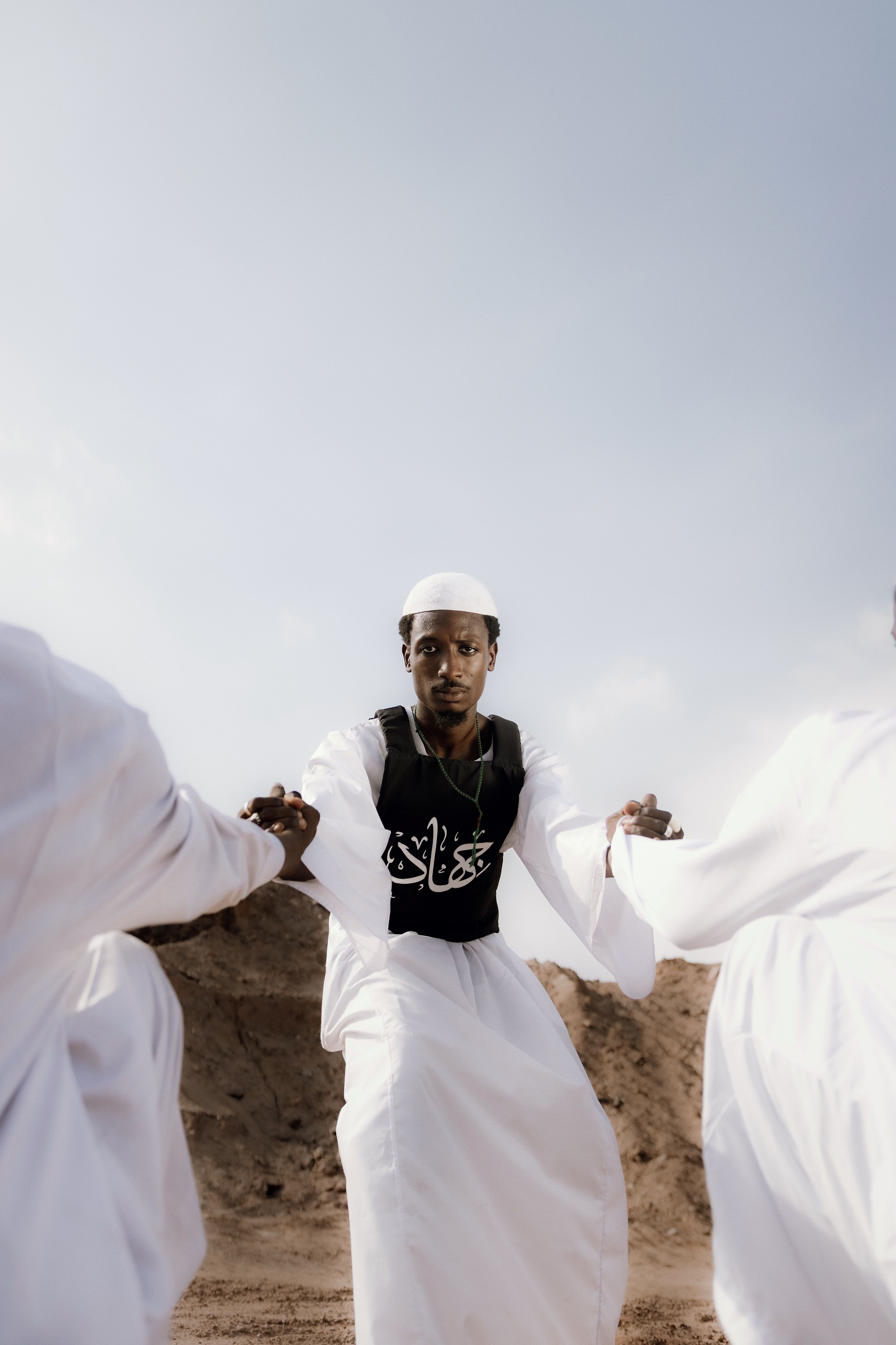 Young Man in Traditional Clothing Embracing Culture · Free Stock Photo