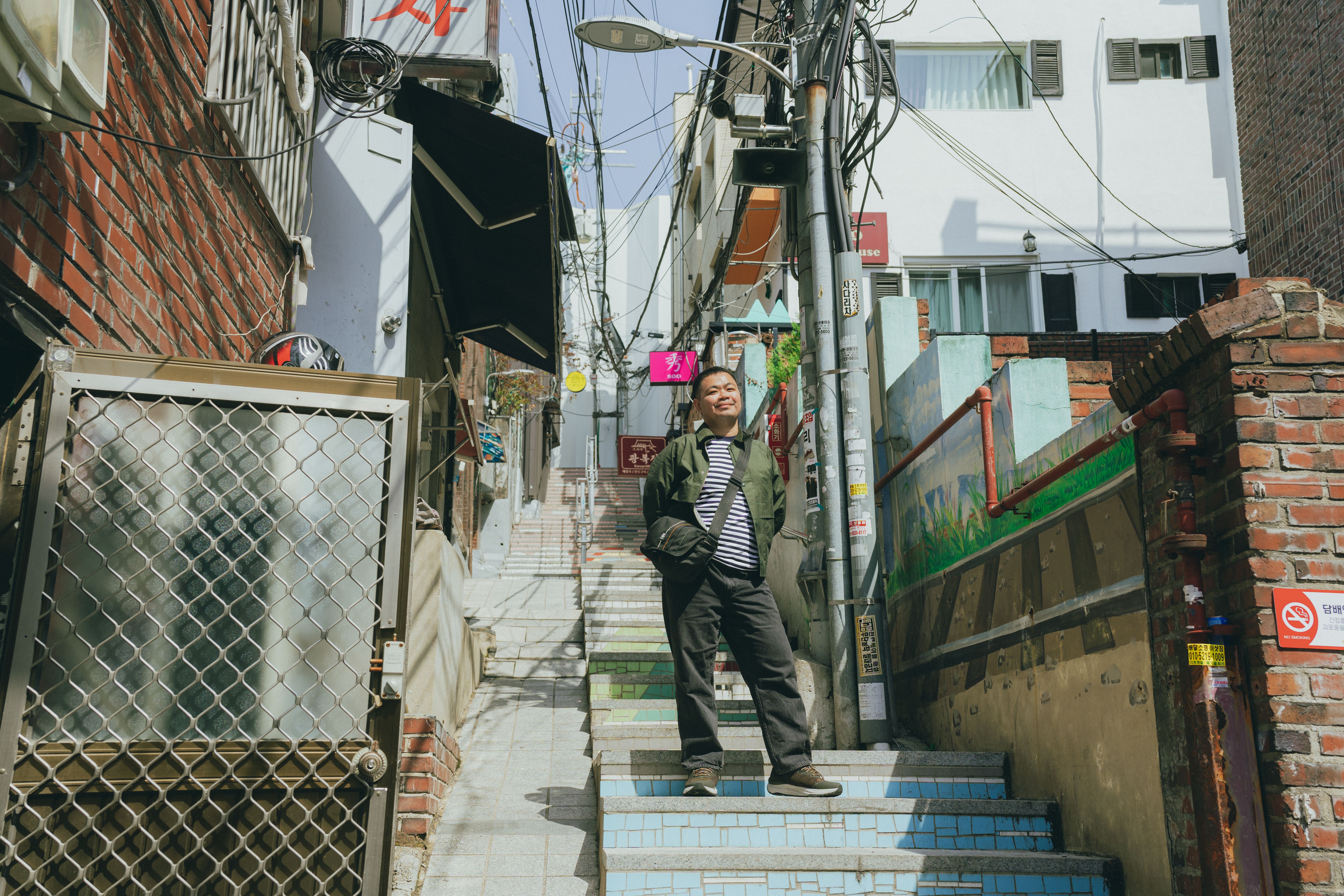 Urban Alleyway in Seoul with Local Resident · Free Stock Photo