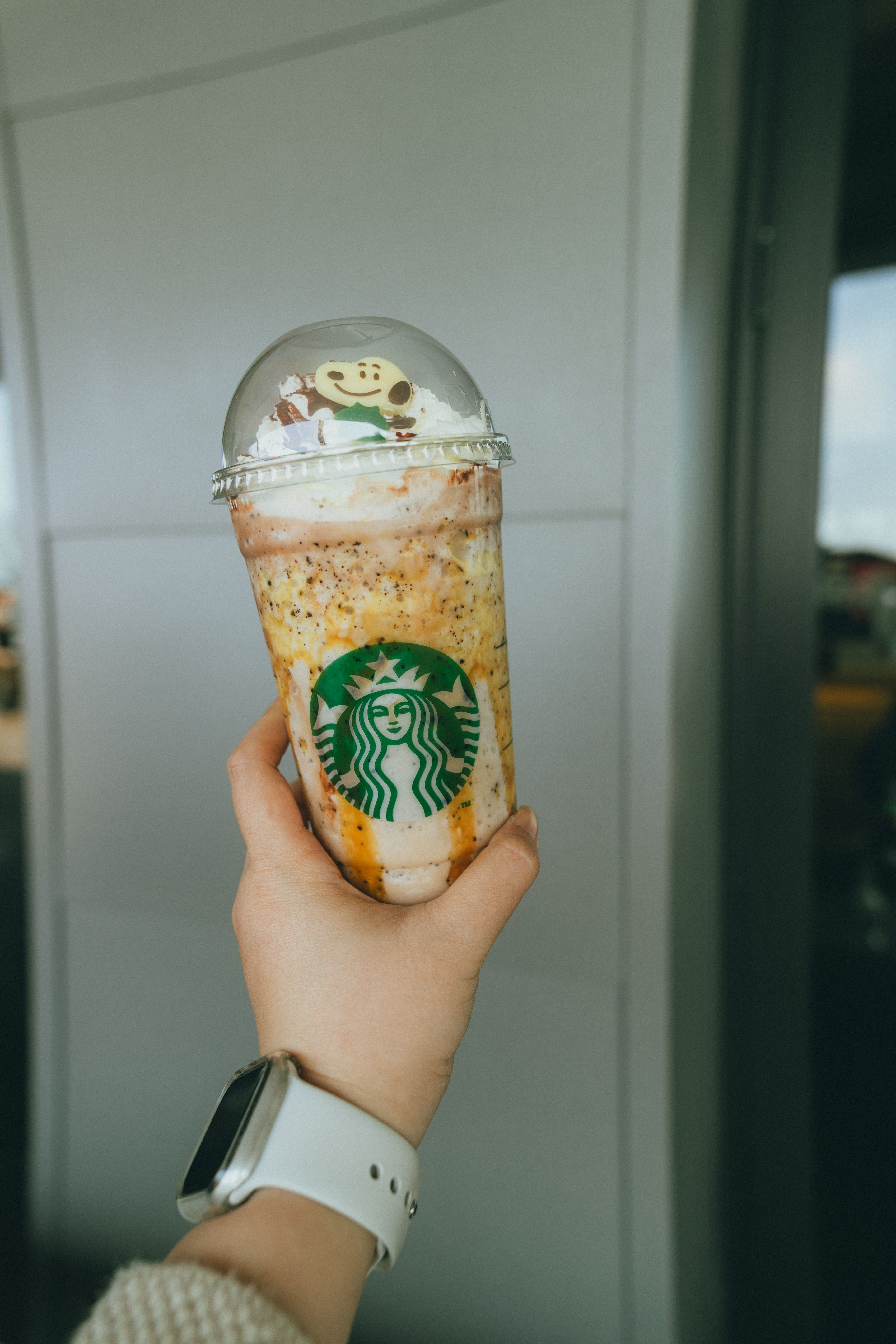 Hand Holding a Starbucks Frappuccino in Seoul · Free Stock Photo