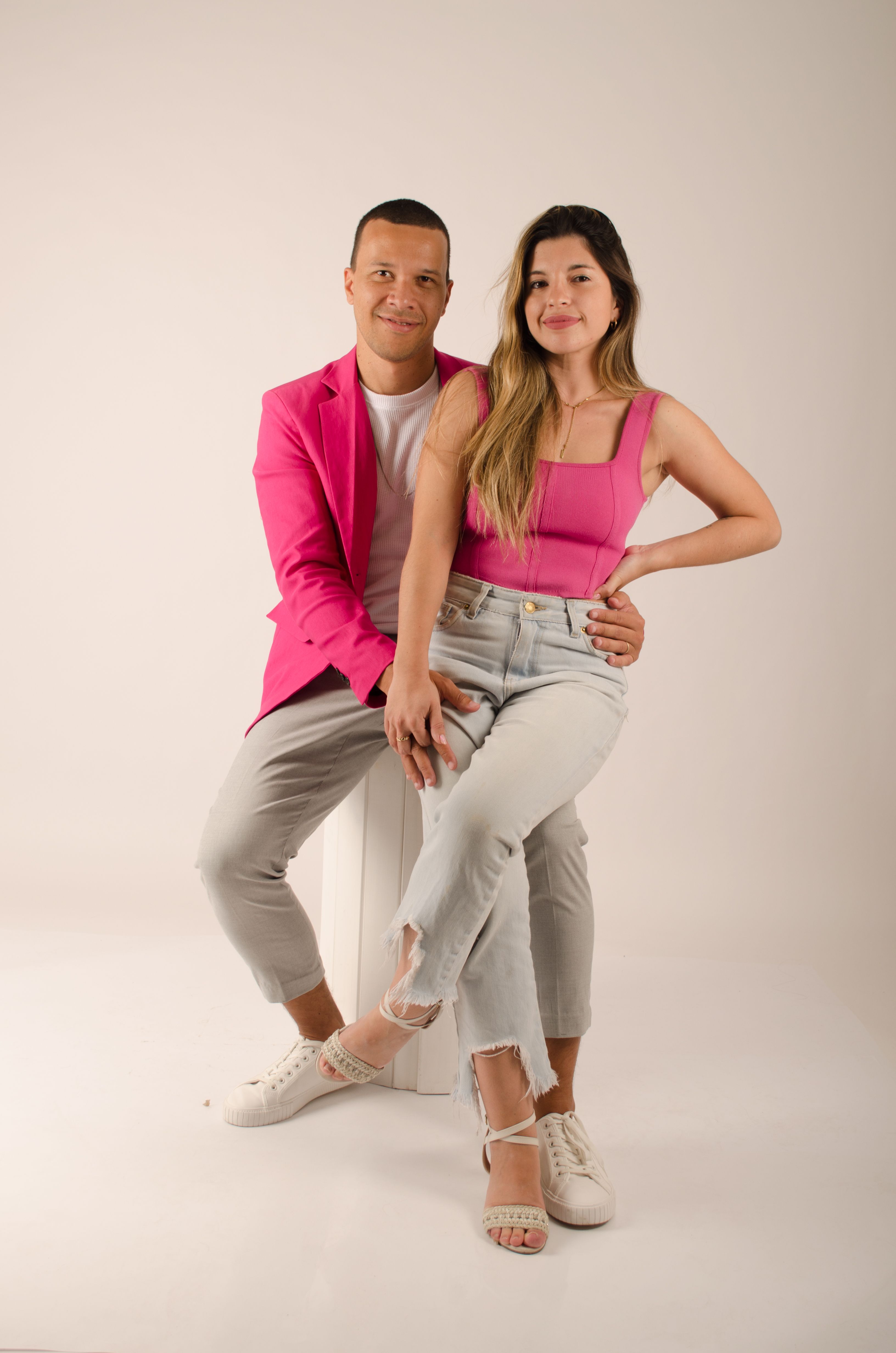 Couple Posed in Pink Casual Outfits · Free Stock Photo