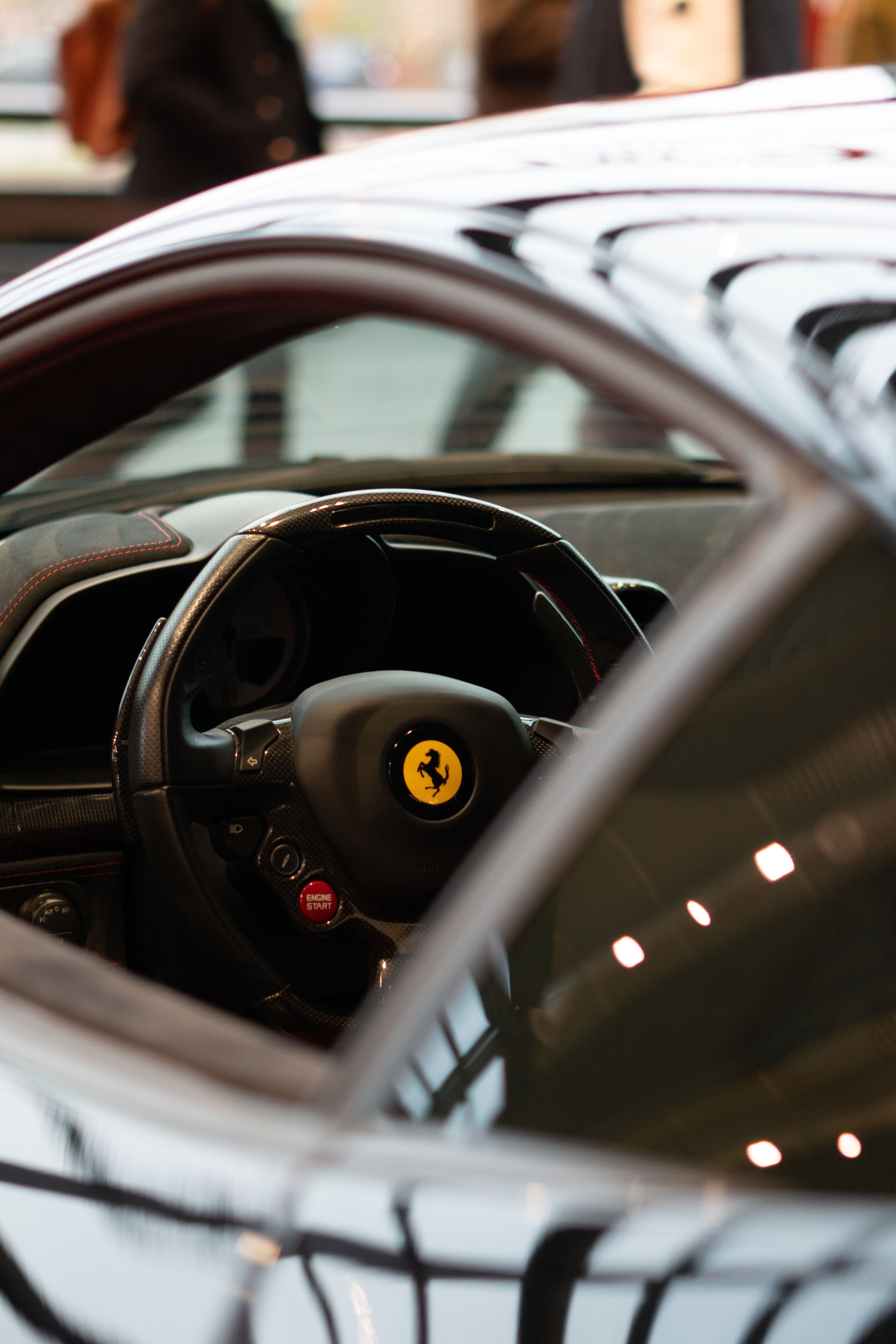 Close-up of Ferrari Steering Wheel in Showroom · Free Stock Photo
