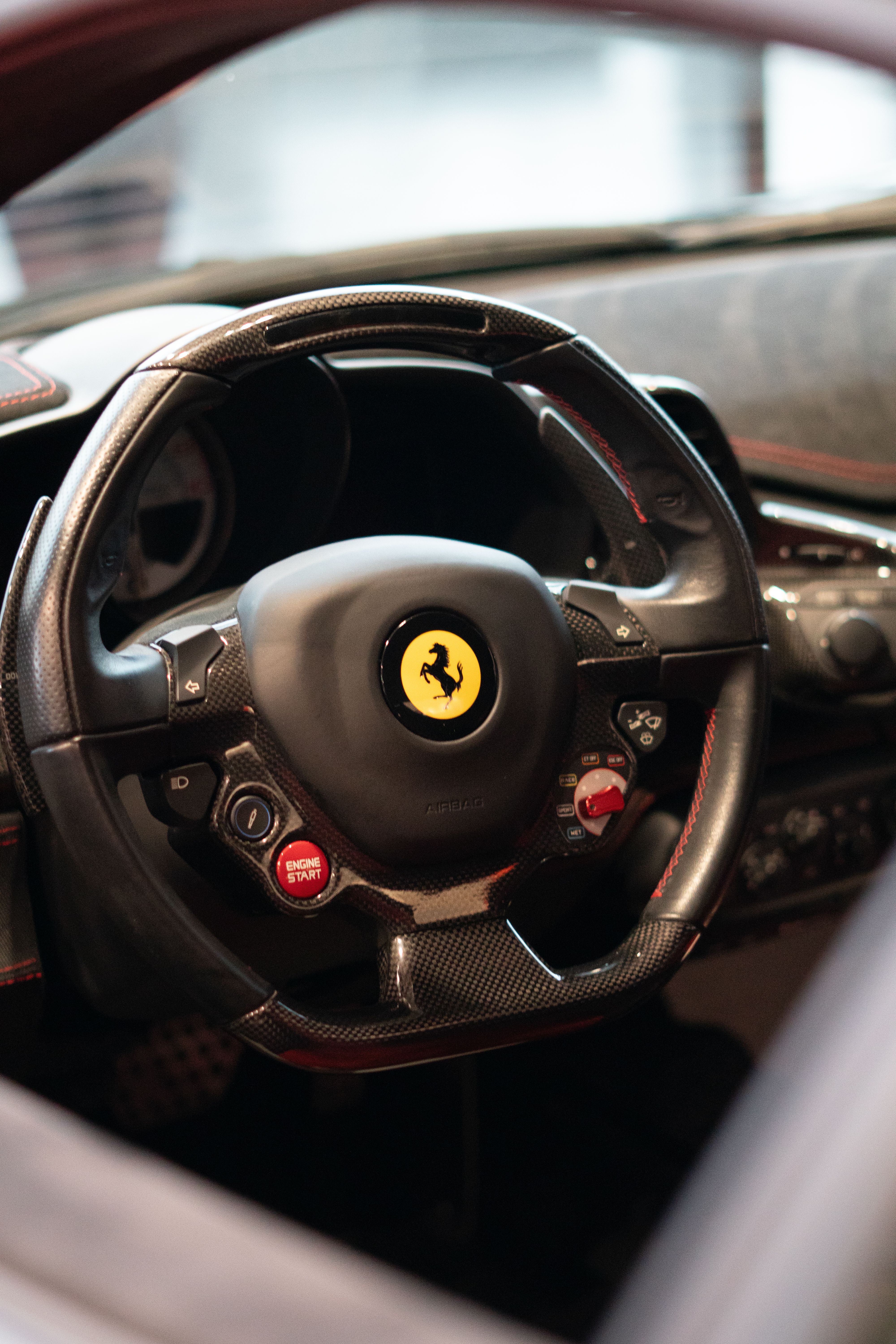 Ferrari Interior Featuring Steering Wheel Details · Free Stock Photo