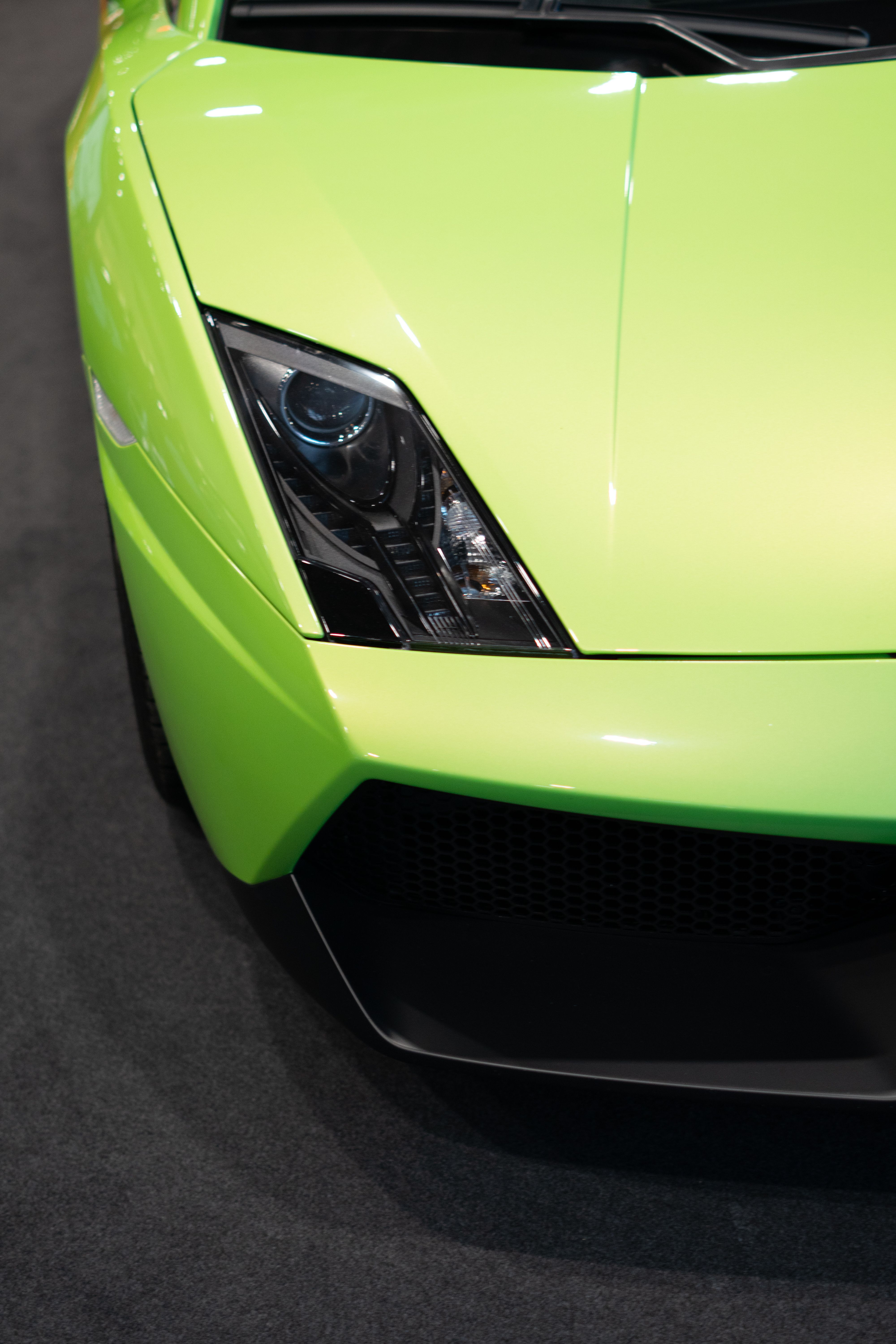 Vibrant Green Supercar Front Close-Up · Free Stock Photo