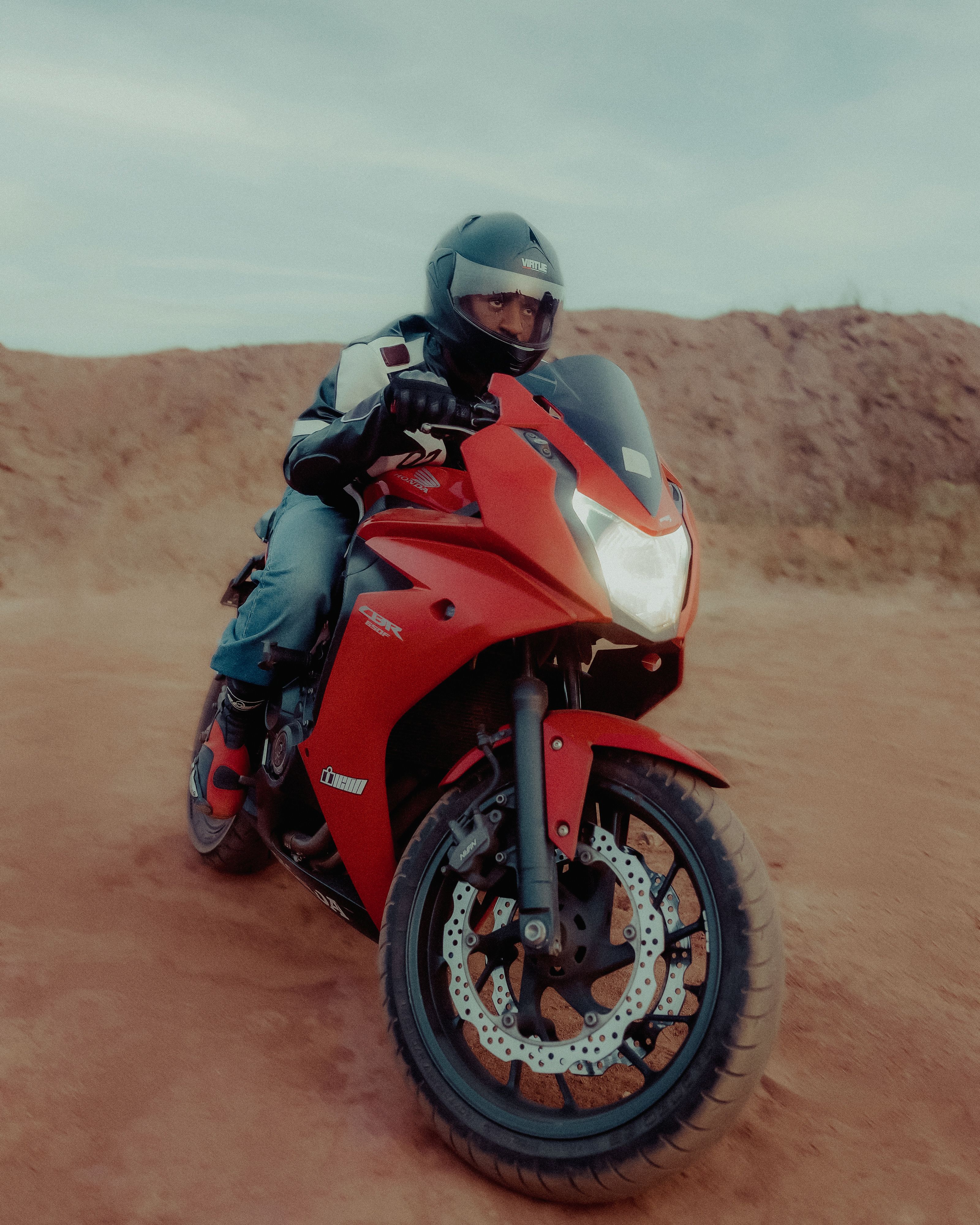 Rider on Red Sport Motorcycle in Desert · Free Stock Photo