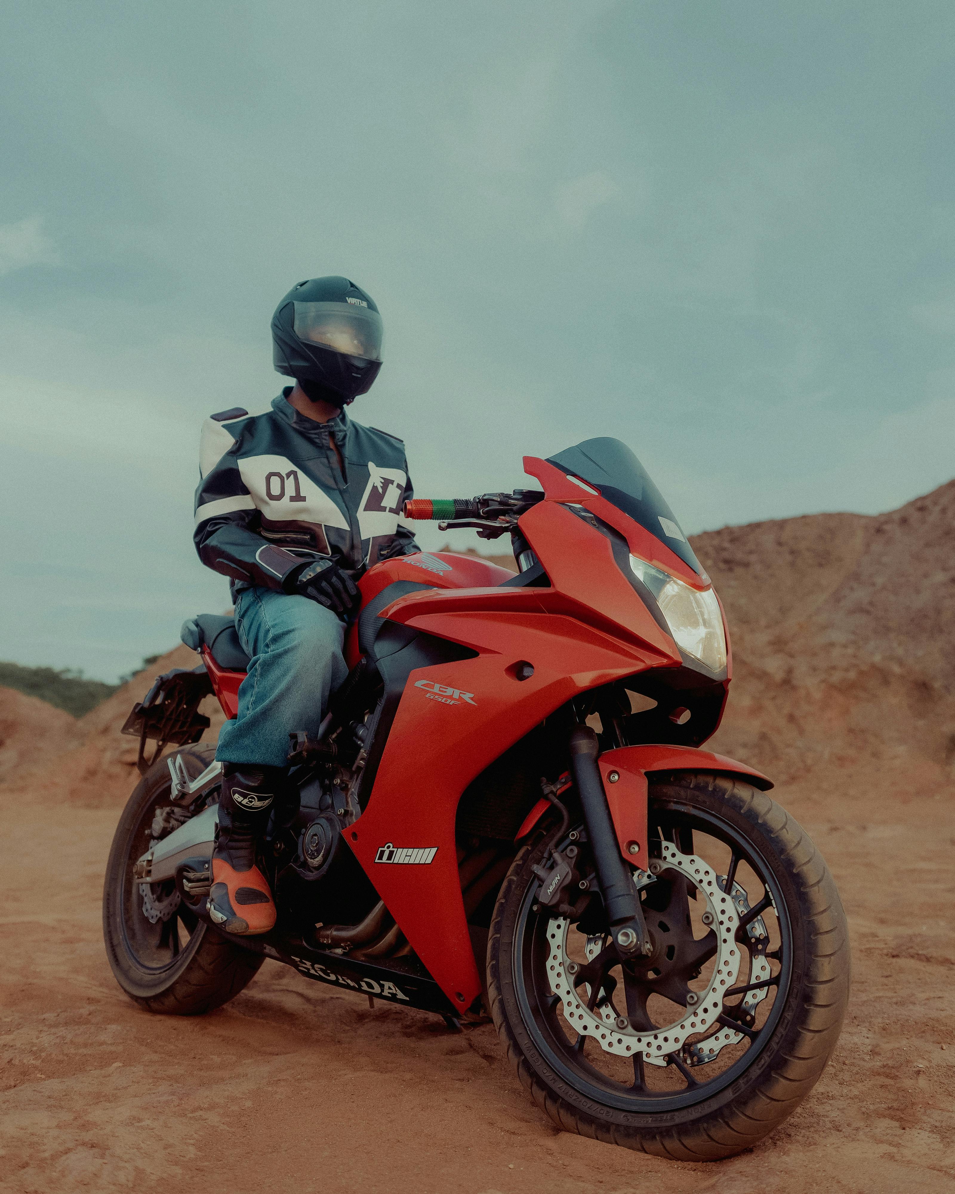 Motorcyclist on Red Sportbike in Desert Setting · Free Stock Photo