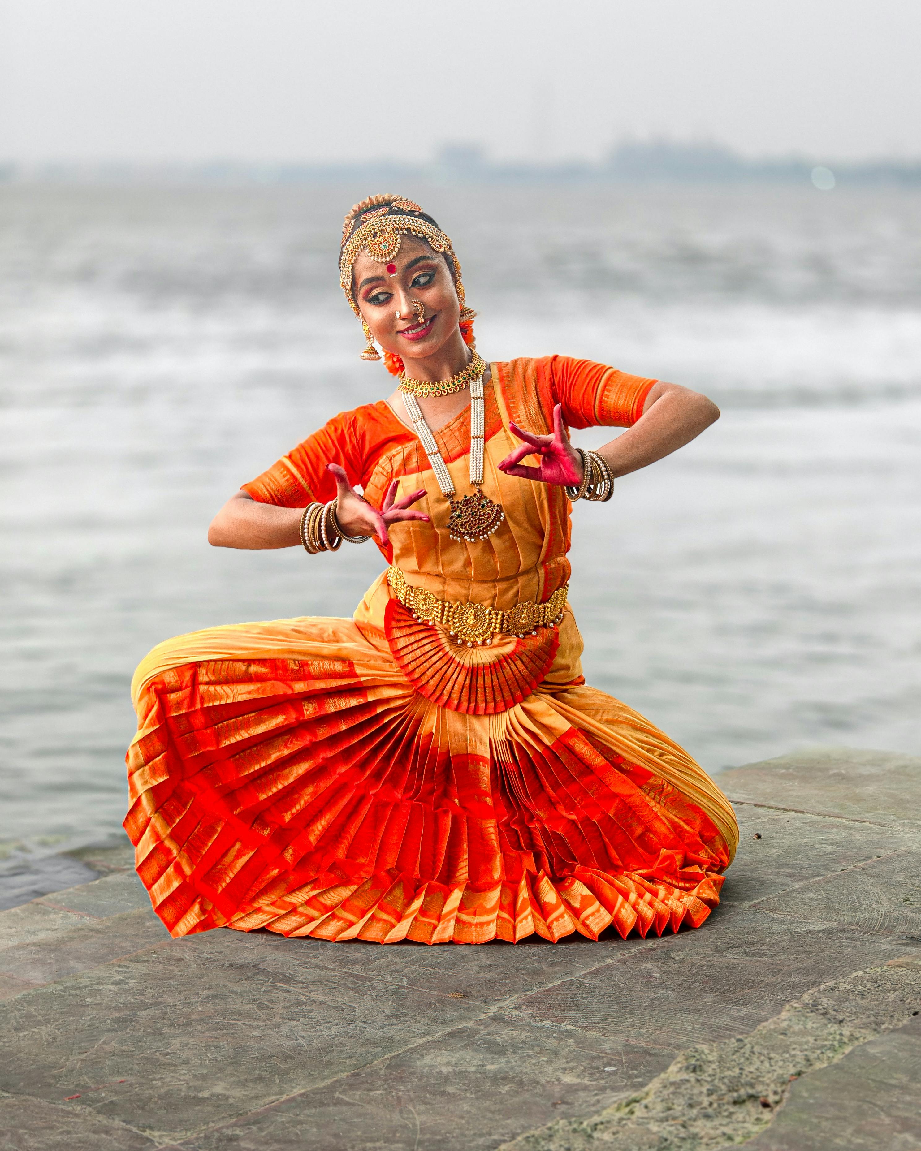 Traditional Indian Dancer by Waterfront · Free Stock Photo