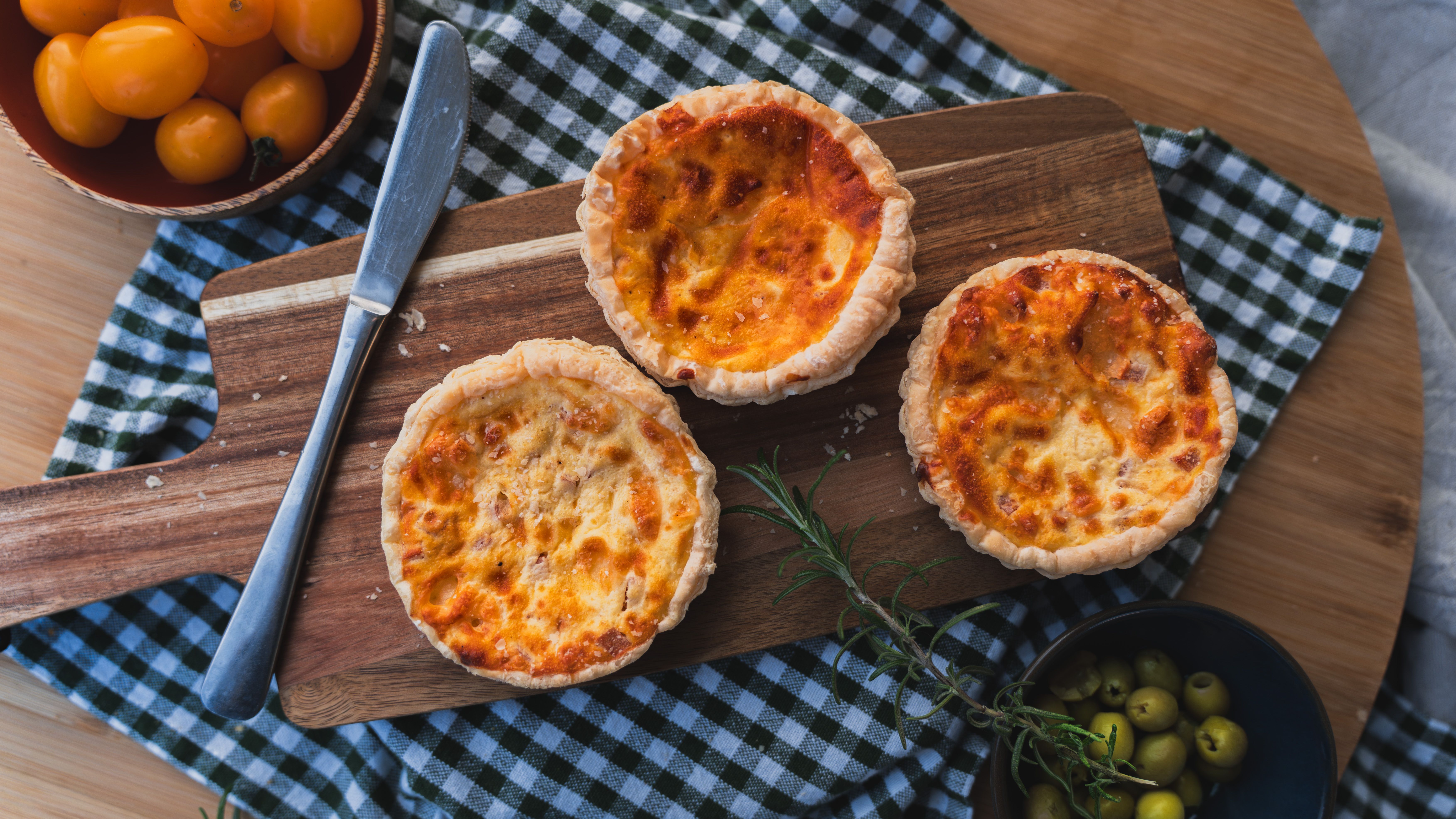 Delicious Mini Quiches on Rustic Wooden Board · Free Stock Photo