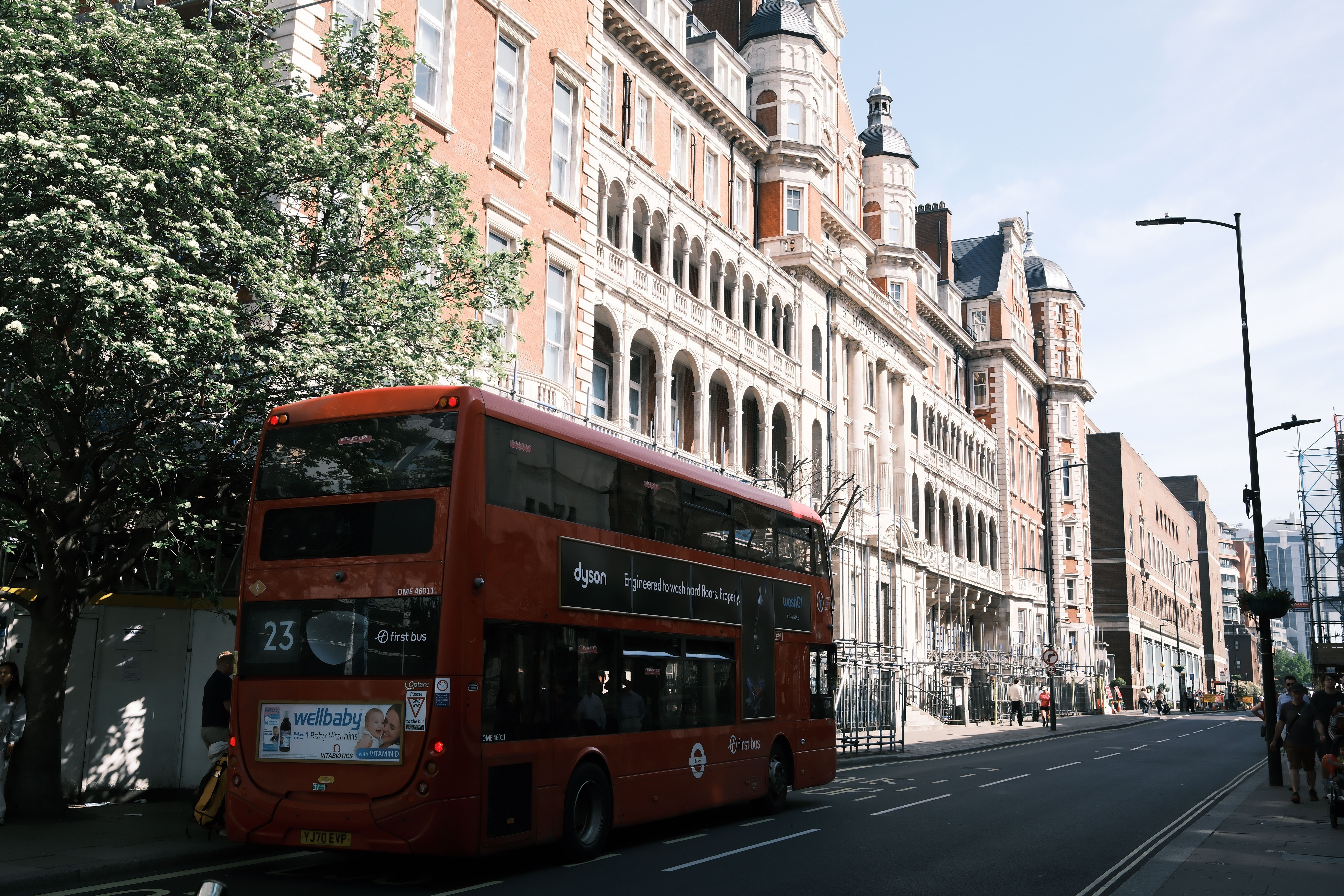 Iconic Red Double-Decker Bus in London Cityscape · Free Stock Photo