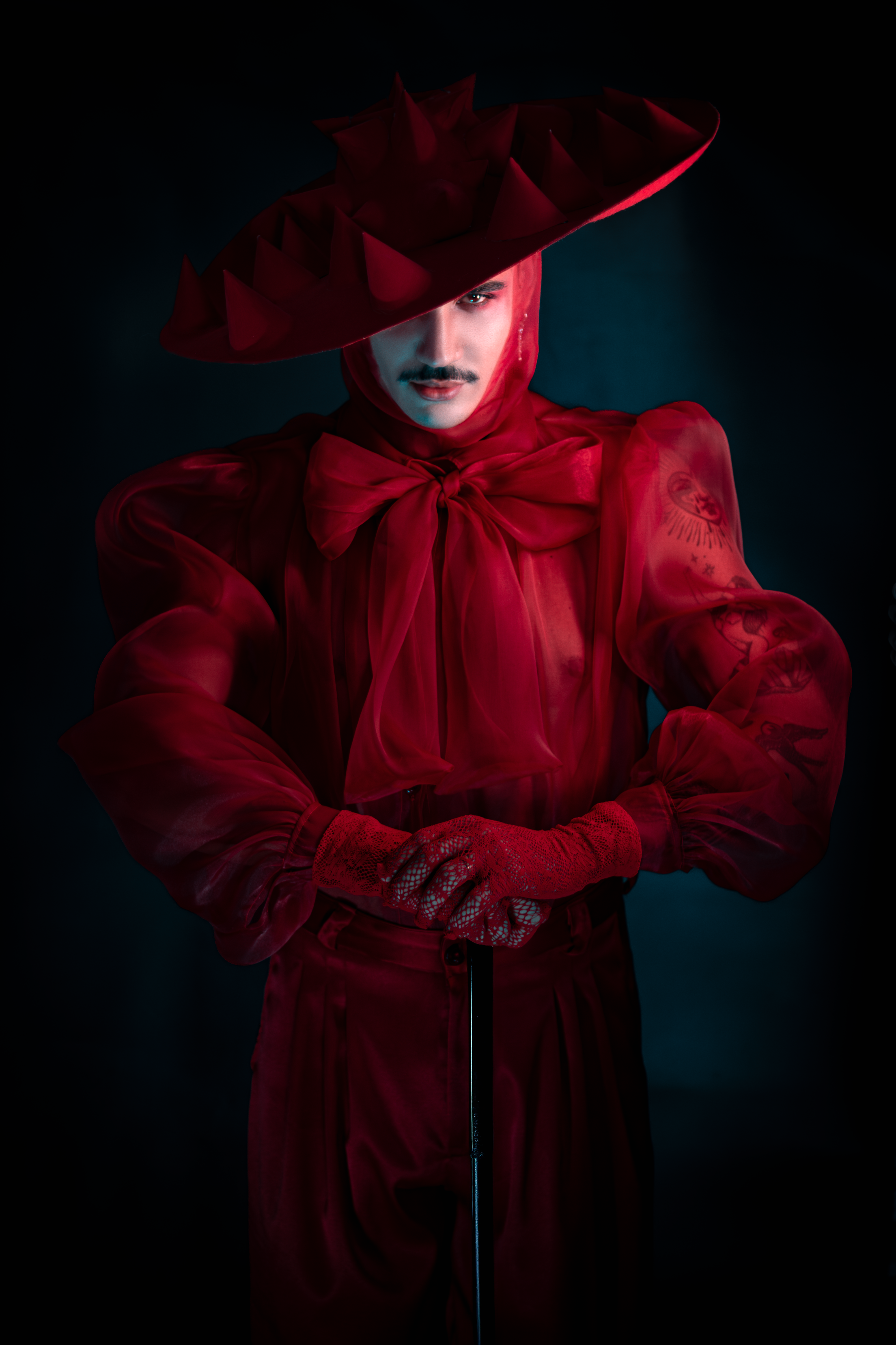 Dramatic Portrait of Person in Red Fashion Outfit · Free Stock Photo