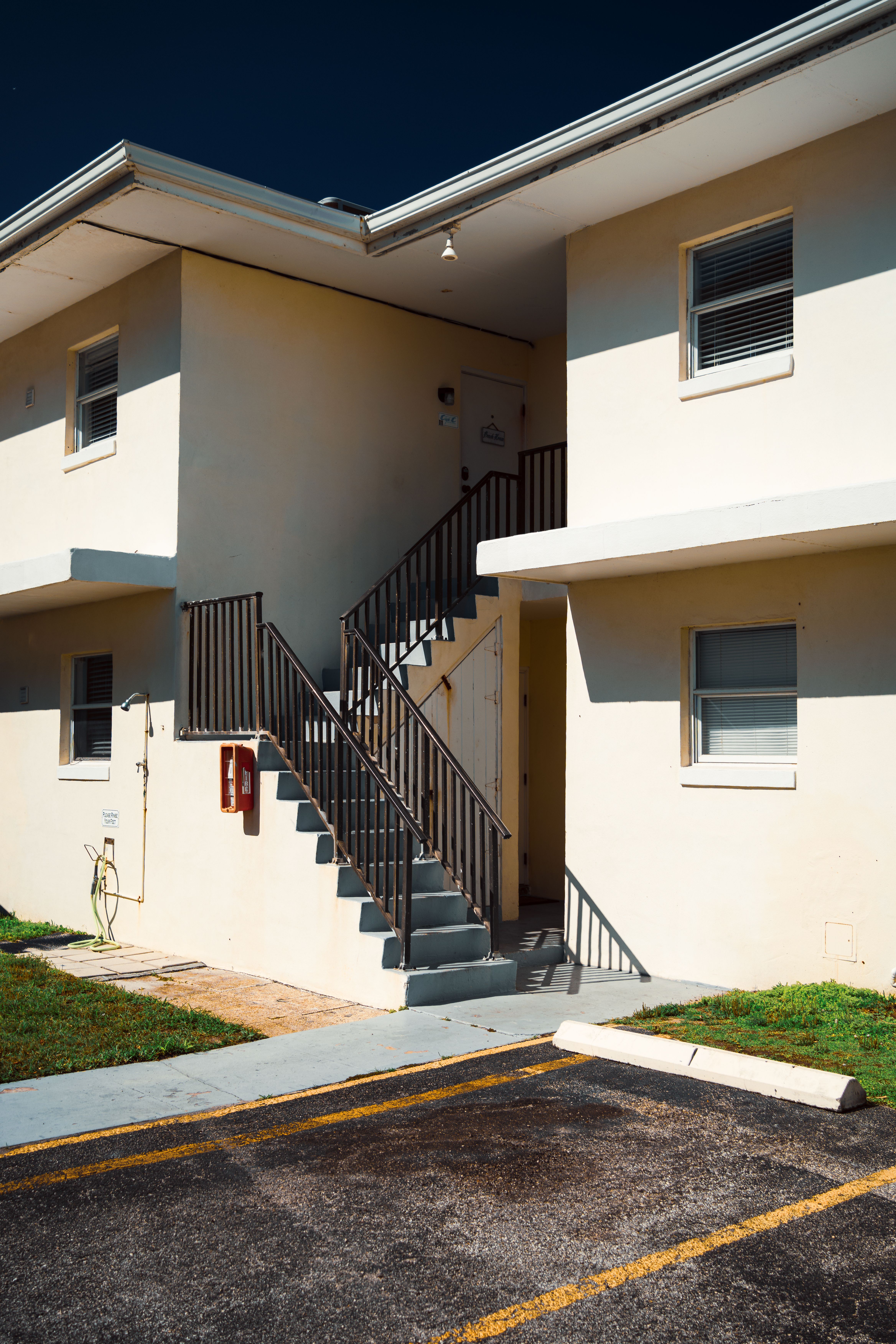 Modern Apartment Building with Outdoor Staircase · Free Stock Photo