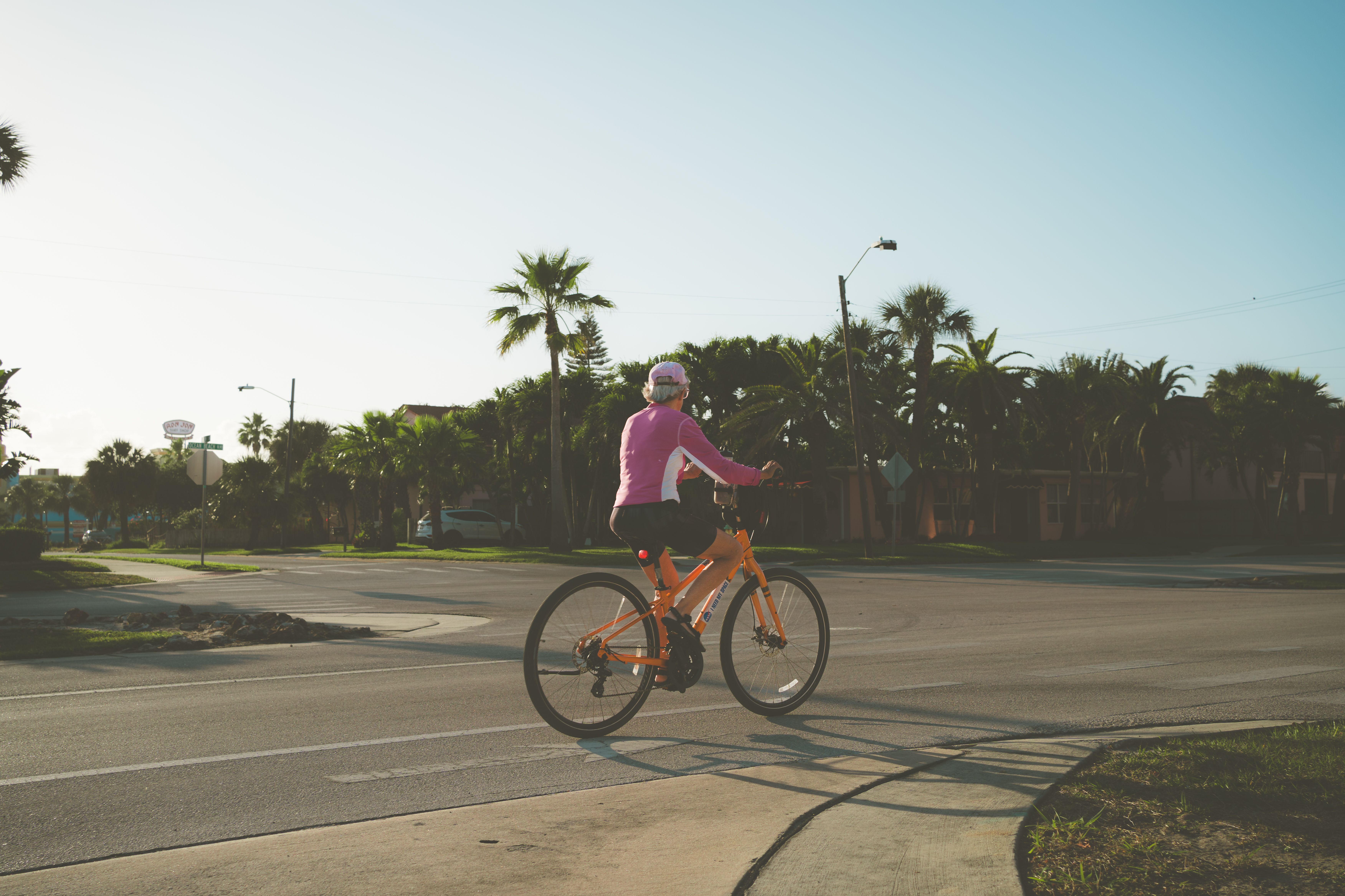 Photo Of Person Standing Beside Bicycle · Free Stock Photo
