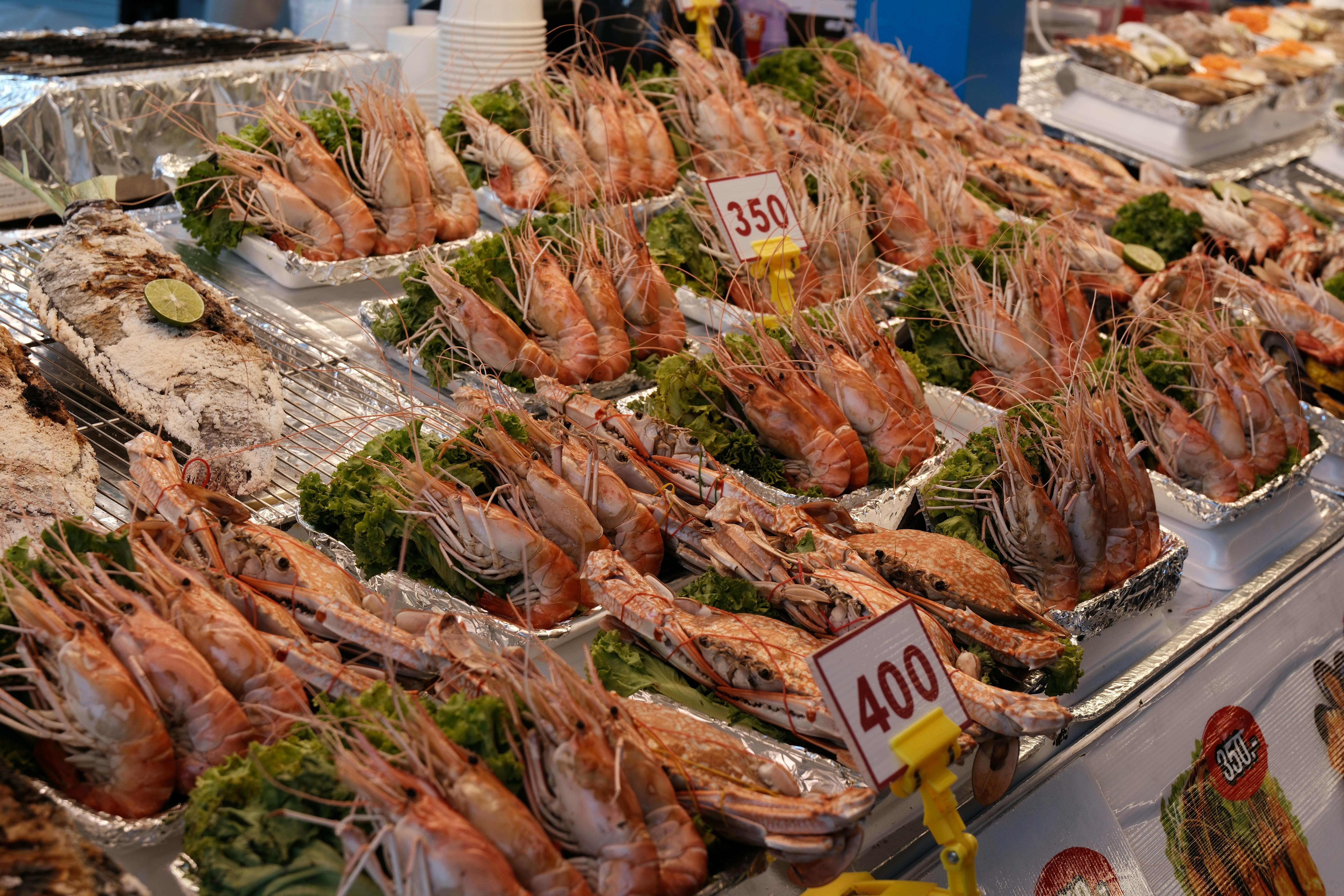 Vibrant Seafood Market Display with Prawns · Free Stock Photo