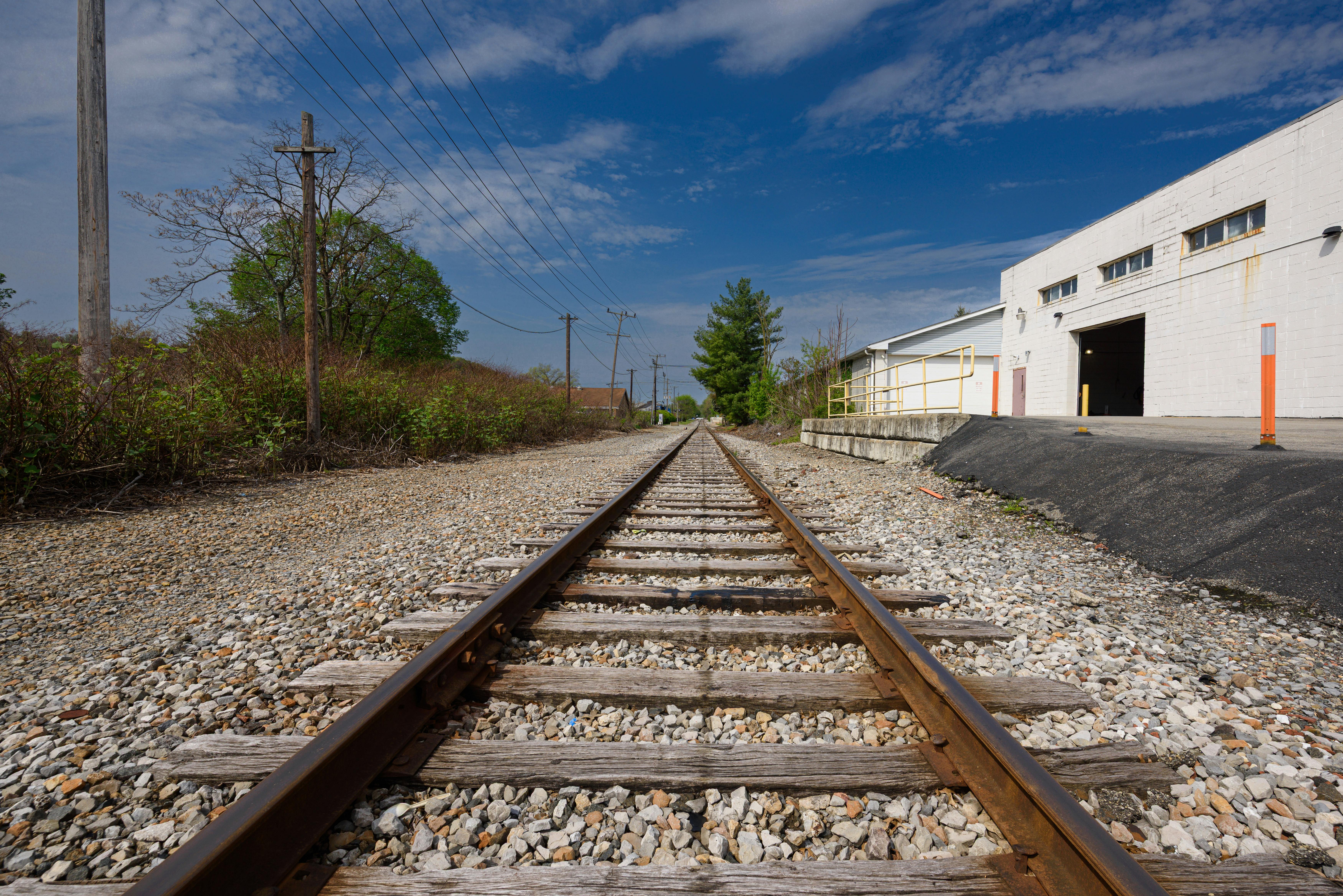 Rustic Railway Tracks with Blue Sky · Free Stock Photo