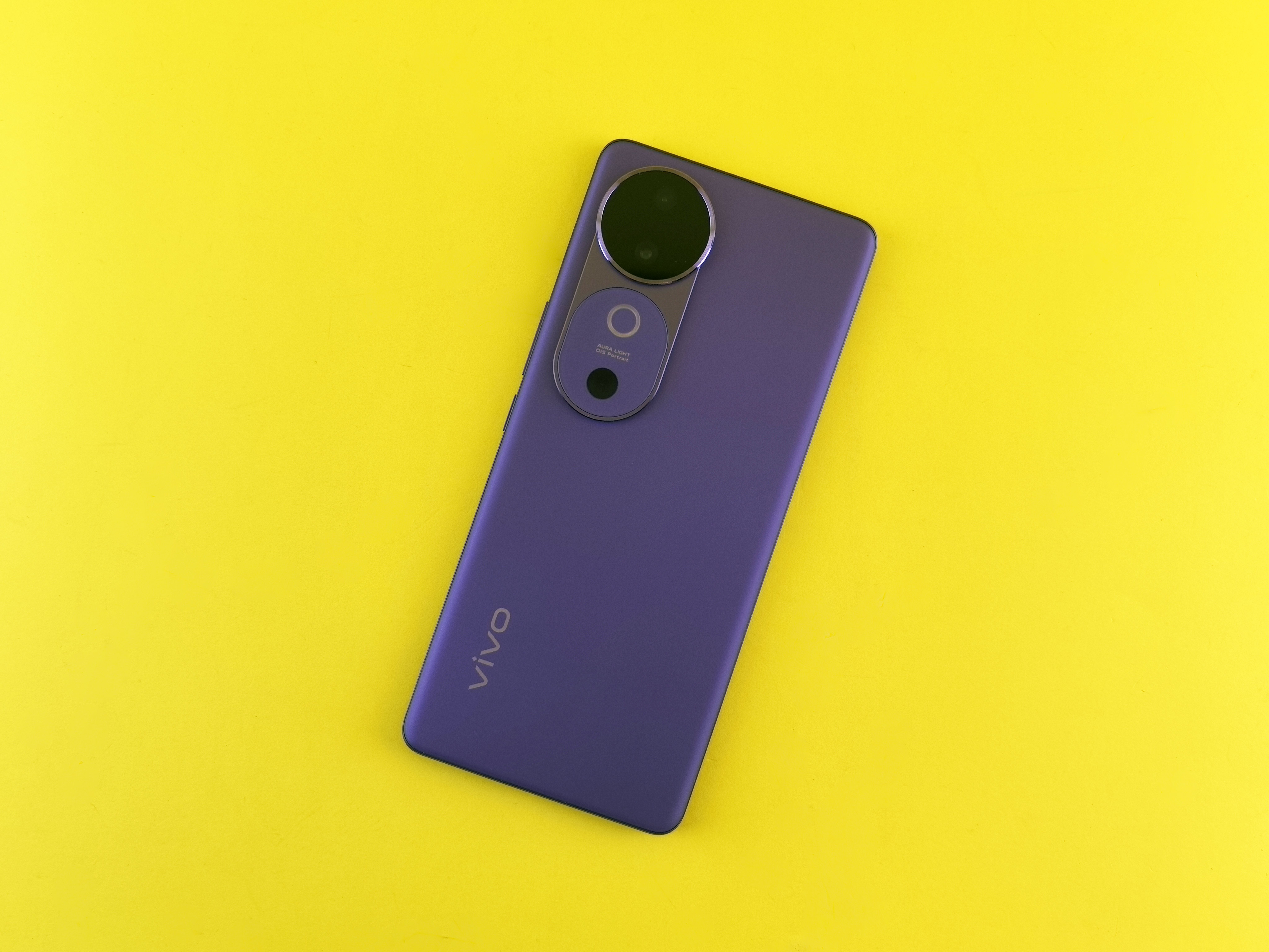 Purple Smartphone on Vibrant Yellow Background · Free Stock Photo
