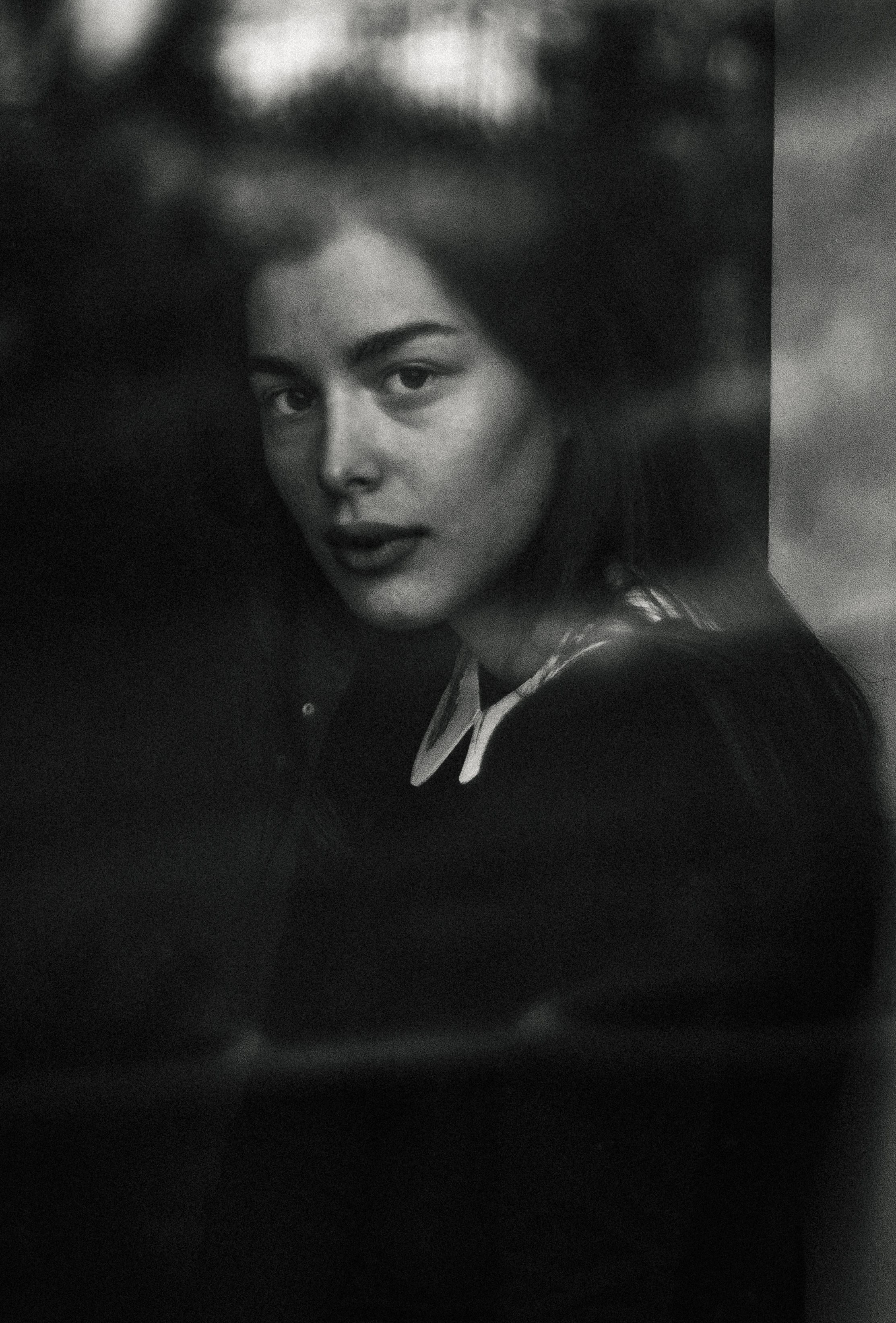 Moody Black and White Portrait through Glass · Free Stock Photo