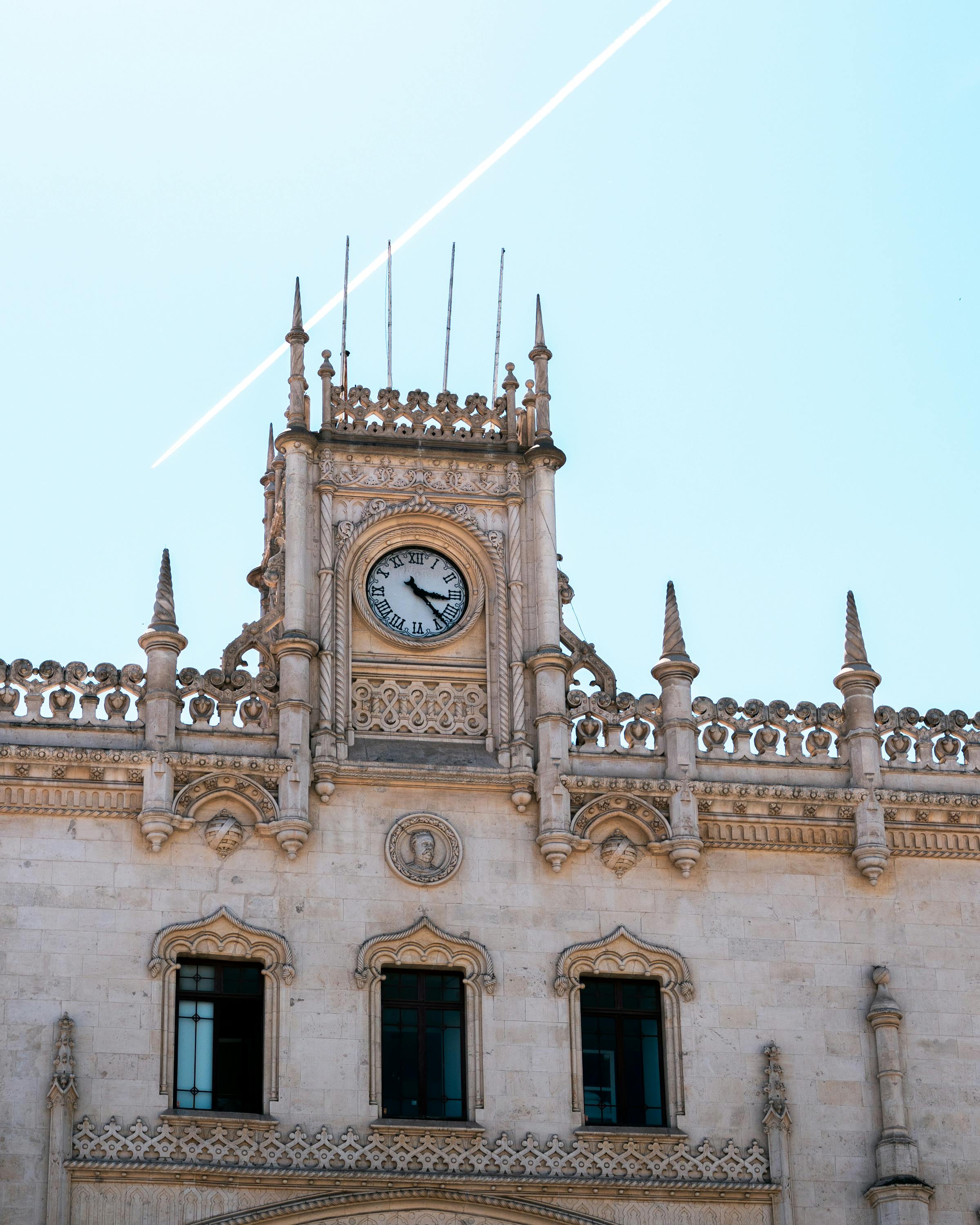 Gothic Clock Tower Against Clear Blue Sky · Free Stock Photo