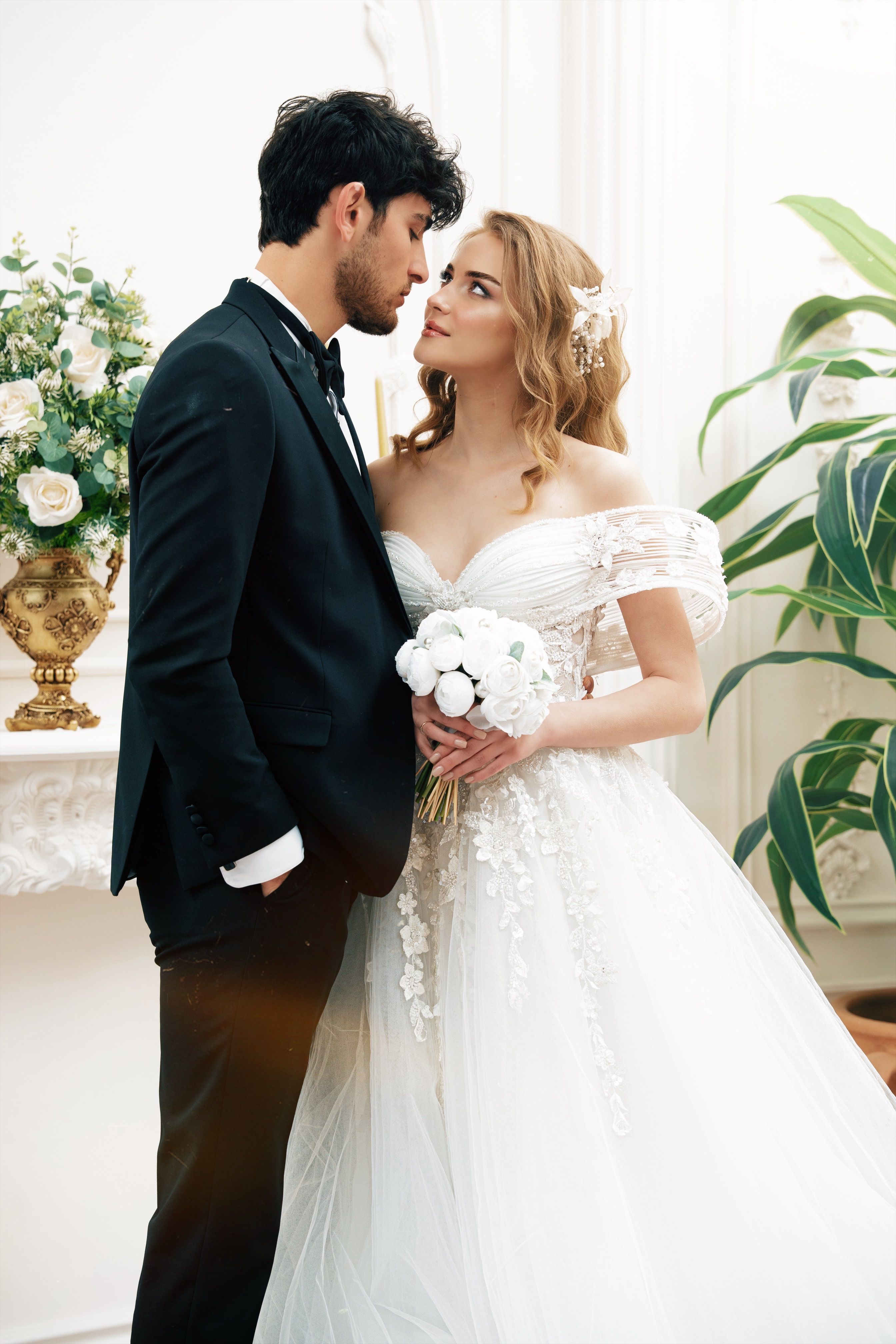Elegant Wedding Couple in Romantic Pose Indoors · Free Stock Photo