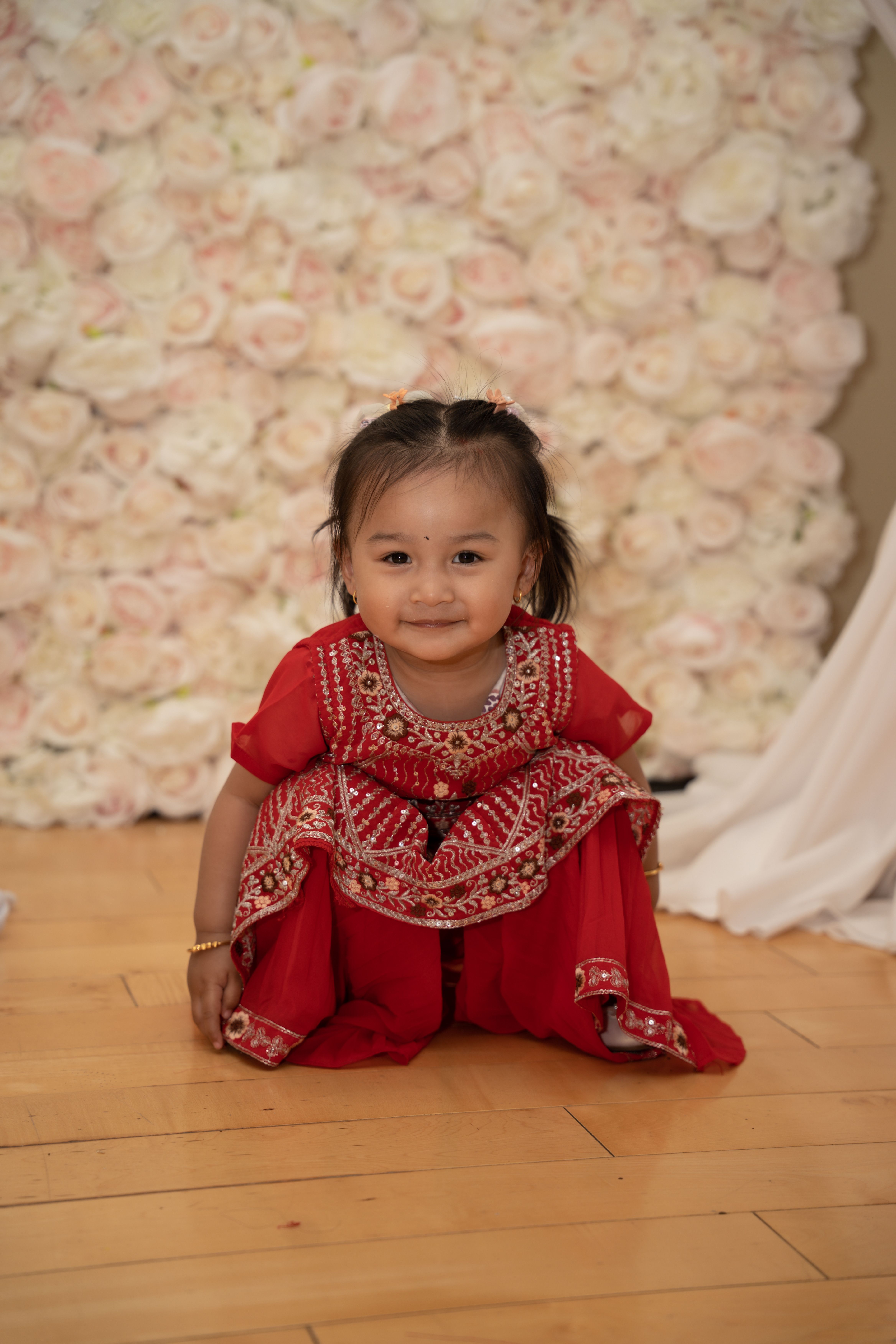 Adorable Child in Traditional Red Dress Indoors · Free Stock Photo
