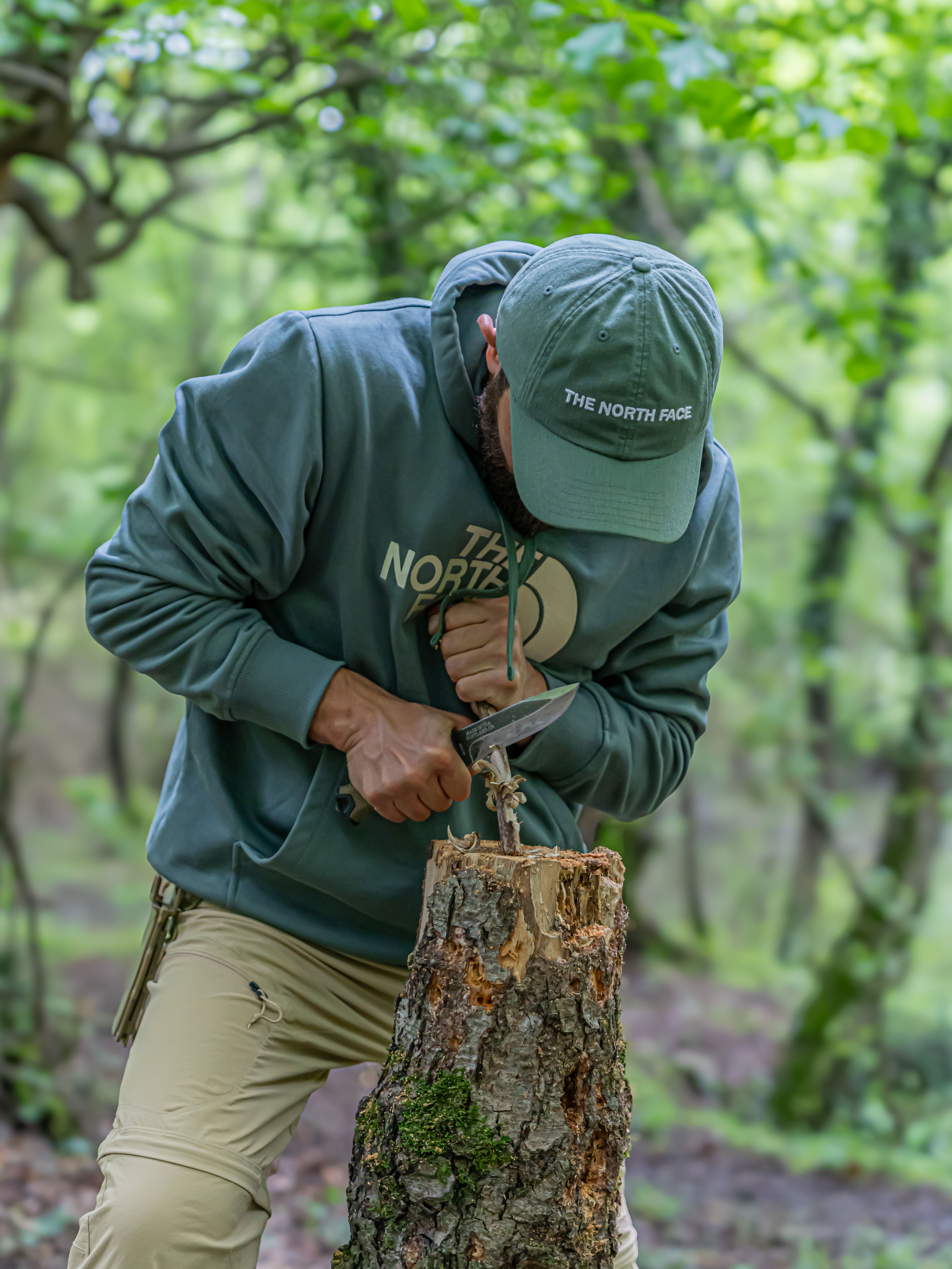 Man Crafting in Forest with Hatchet · Free Stock Photo
