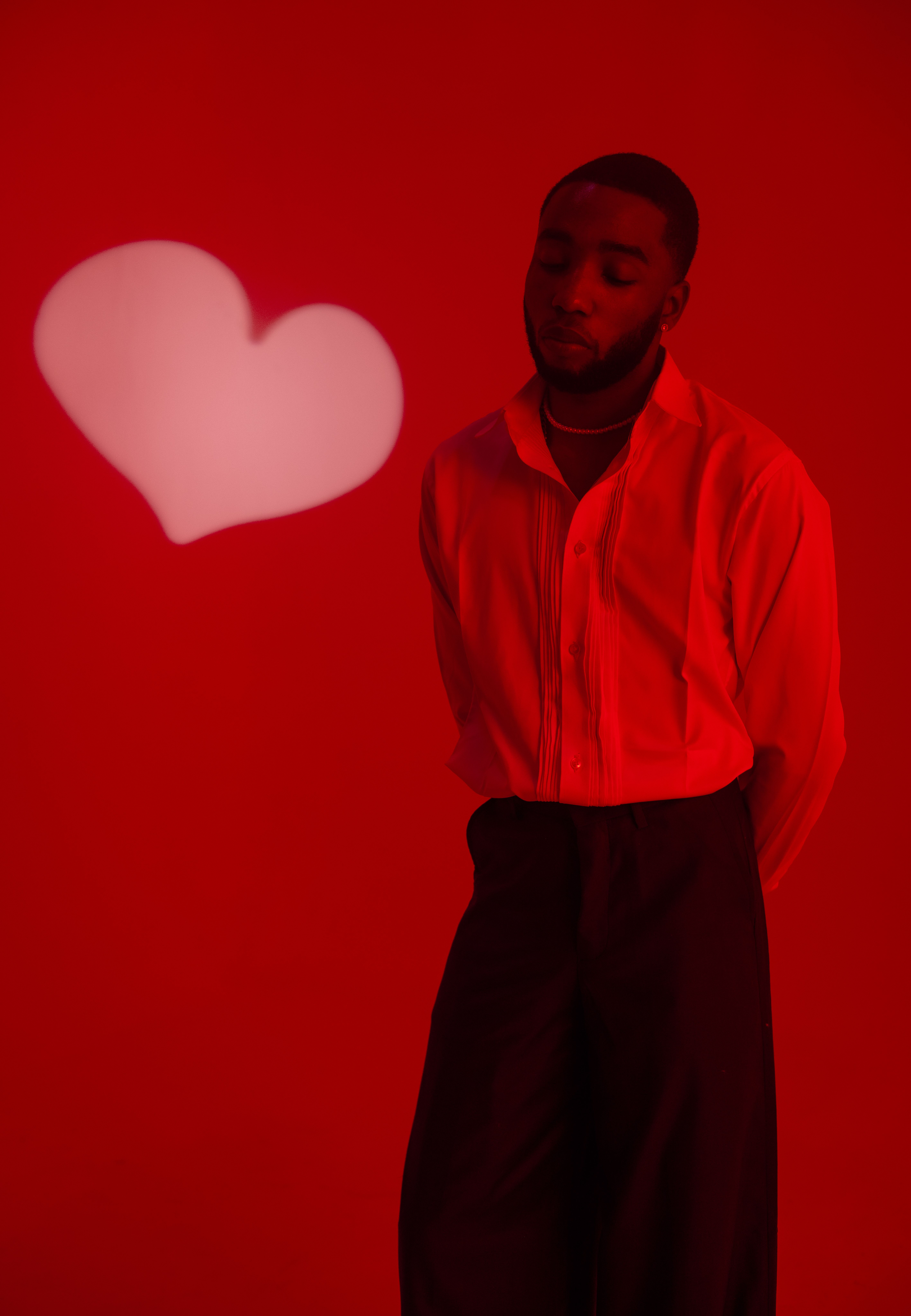 Romantic Mood with Heart Projected on Red Background · Free Stock Photo
