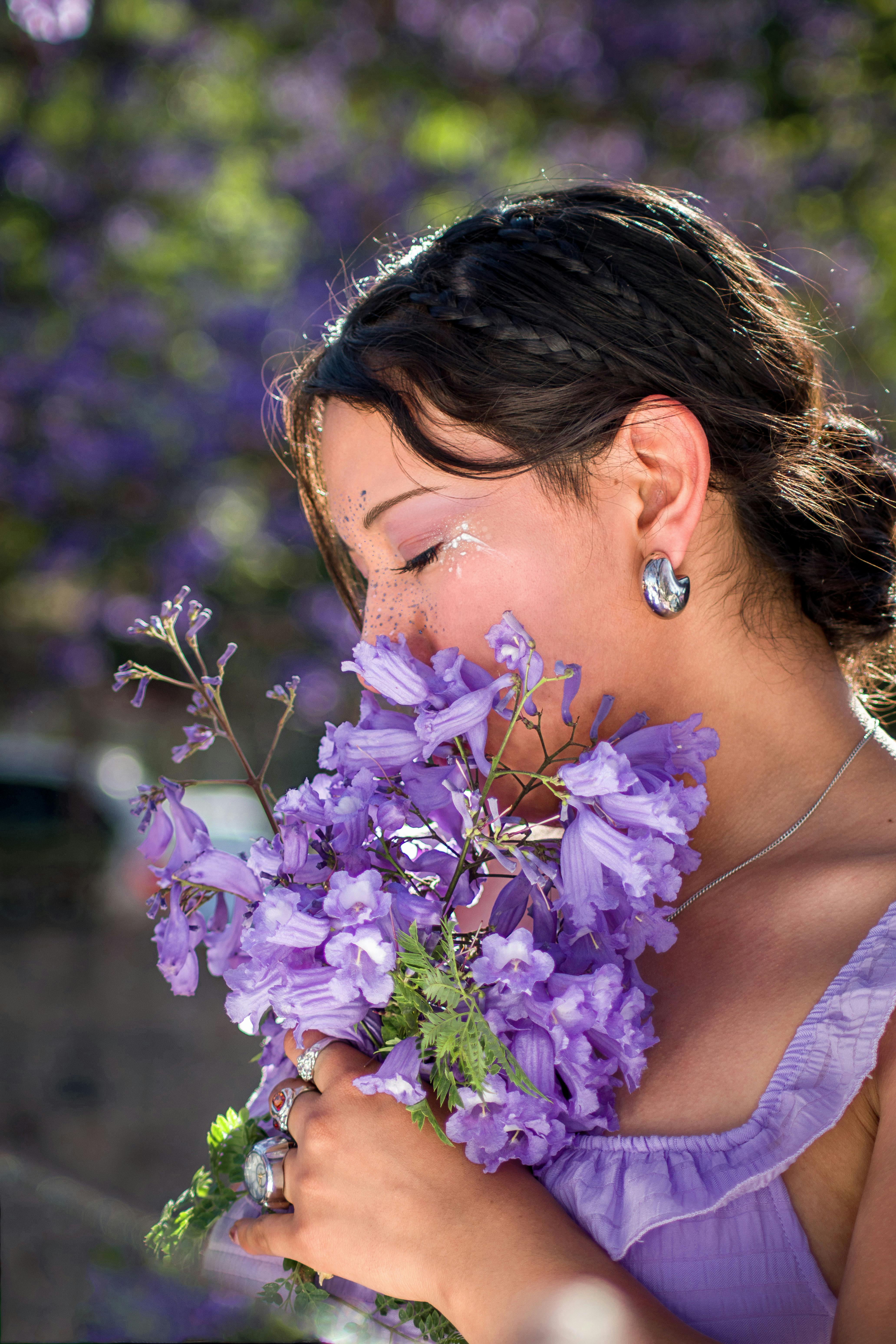 Young Woman Enjoying Jacaranda Blossoms in Mexico · Free Stock Photo