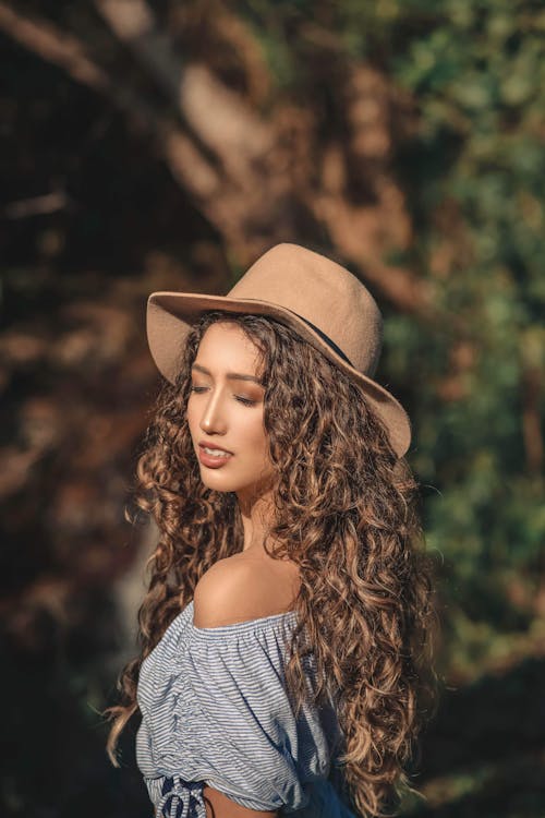 Selective Focus Photography Of Woman Wearing White Crop Top Smiling