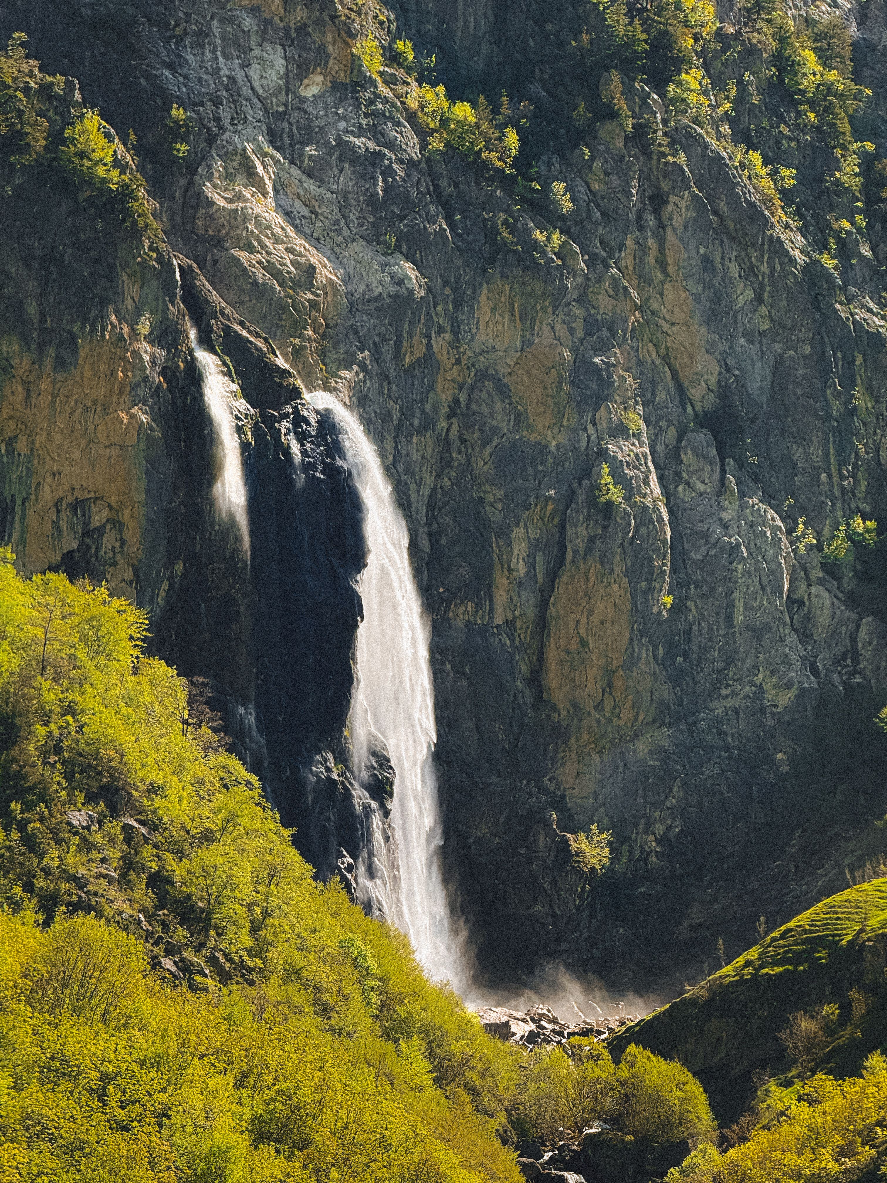 Stunning Waterfall Cascading Over Rocky Cliff · Free Stock Photo