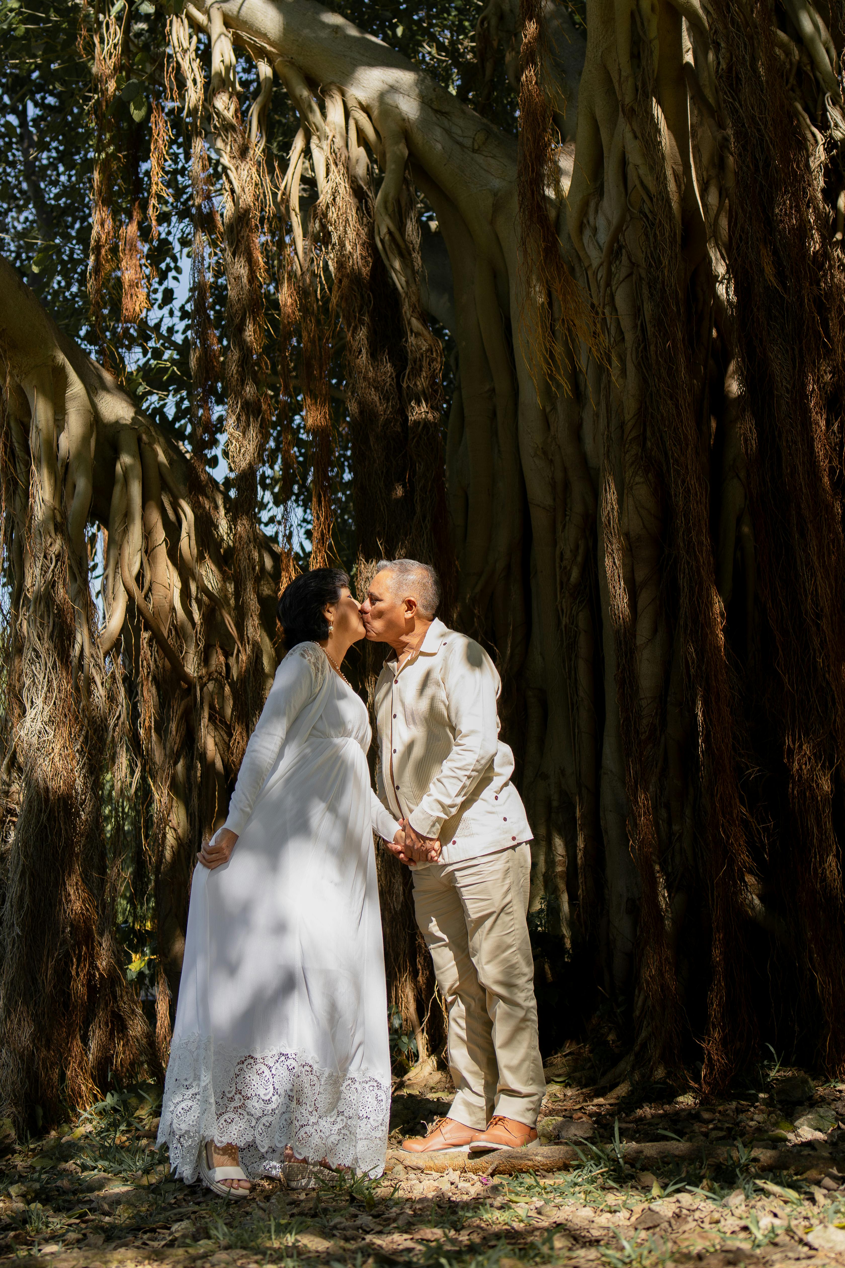 Romantic Couple Kissing in Yucatan Forest · Free Stock Photo