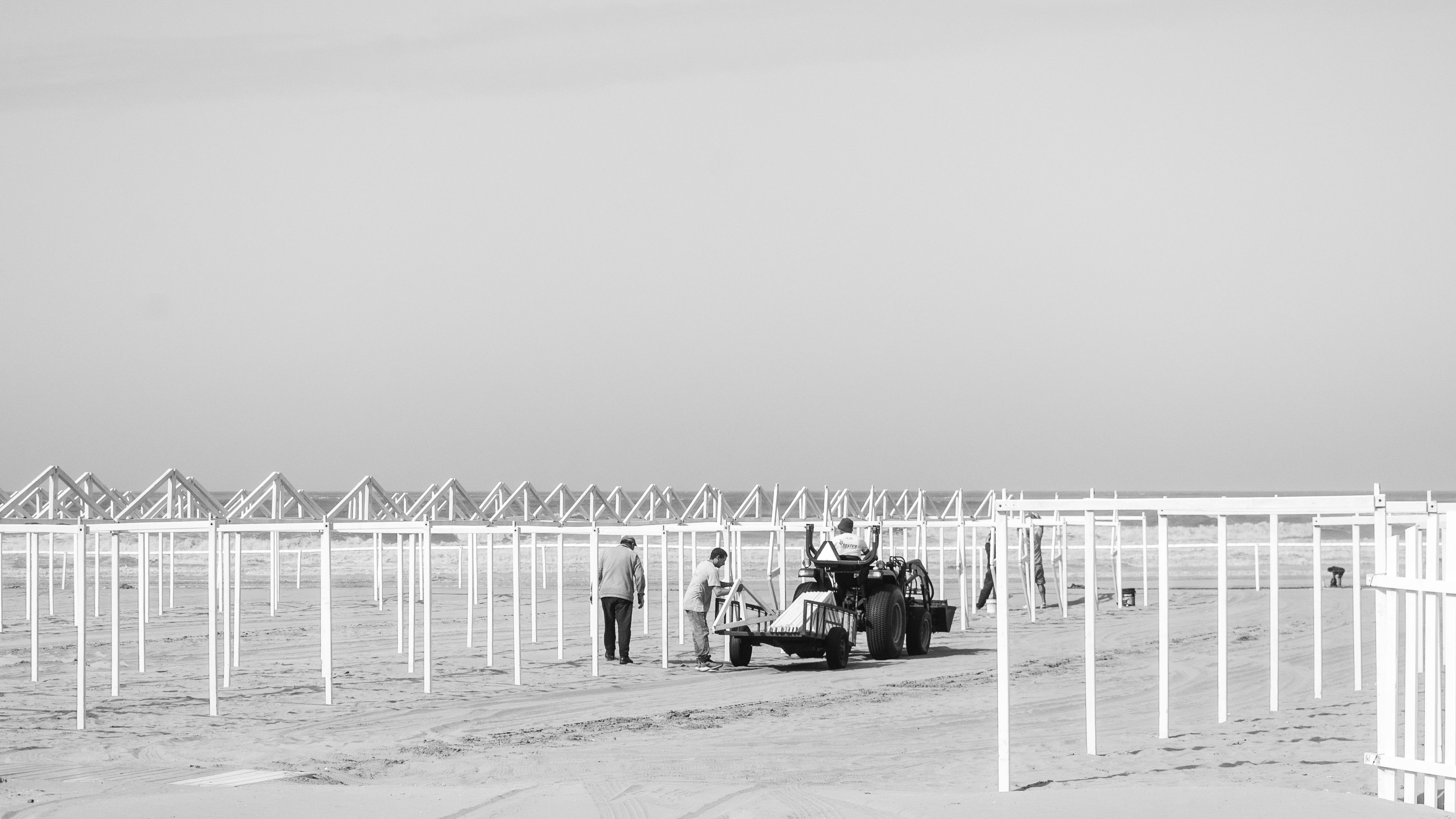 Black and White Beach Construction Scene · Free Stock Photo